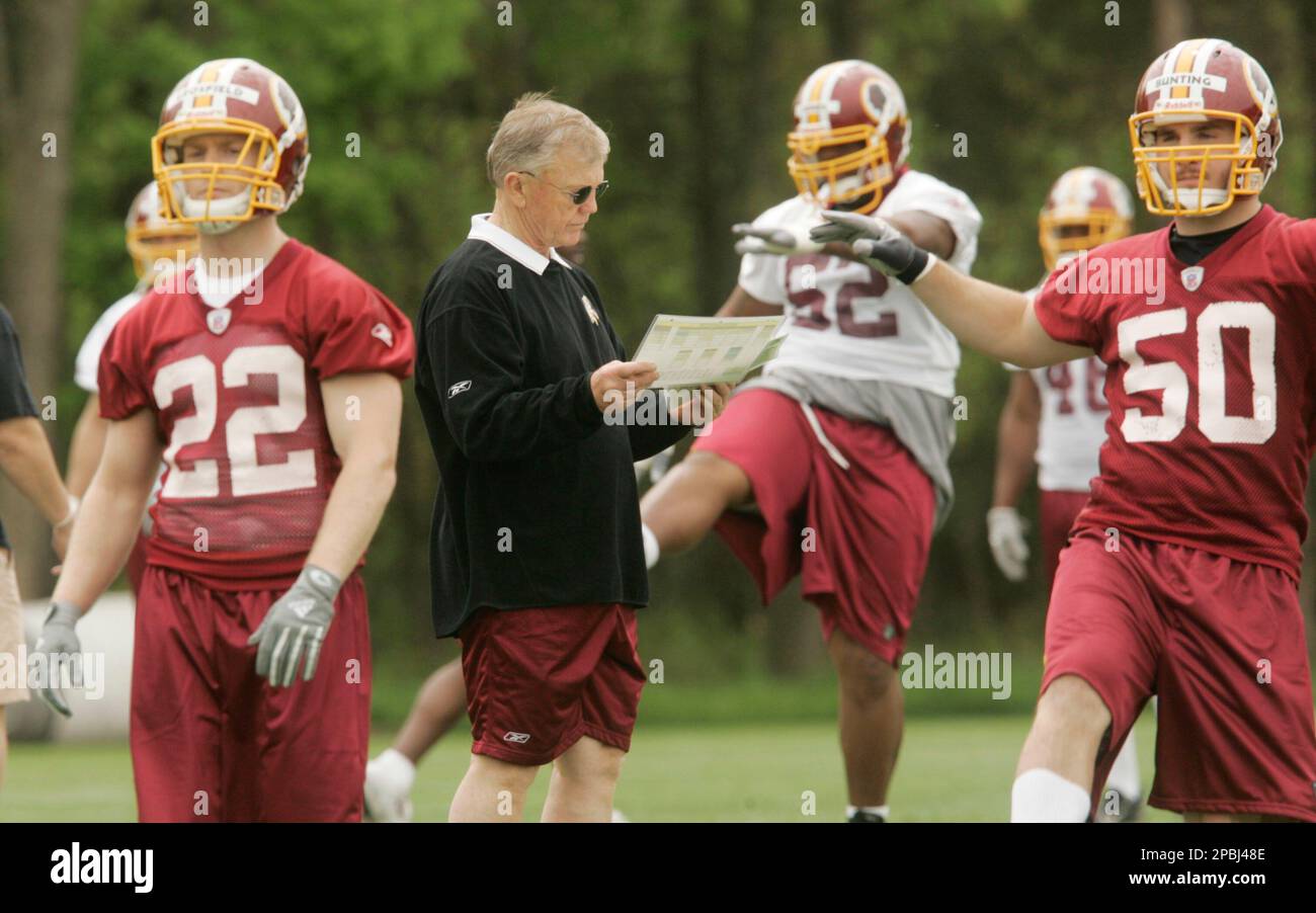 Washington Redskins head coach, Joe Gibbs, second from the left, looks ...
