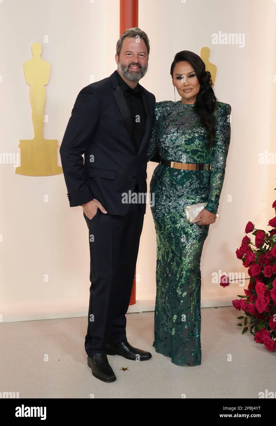 Paul Debevec, left, and Tia Carrere arrive at the Oscars on Sunday ...