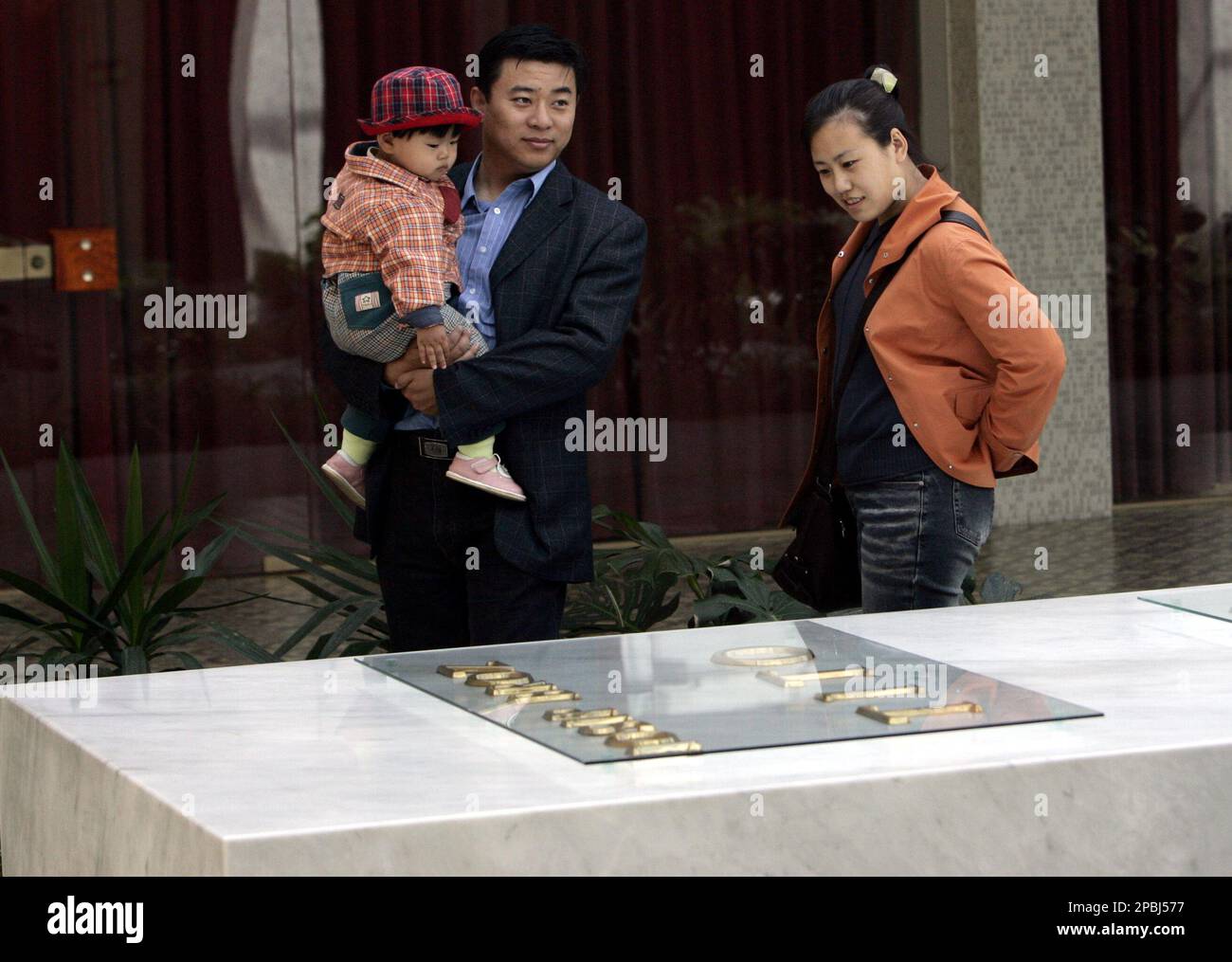 A Chinese family stand by former Yugoslav President Josip Broz Tito ...