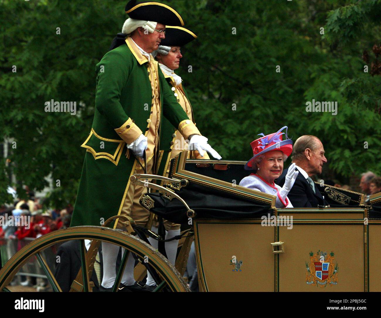 Queen Elizabeth II and Prince Philip rides in a carriage down Duke of ...