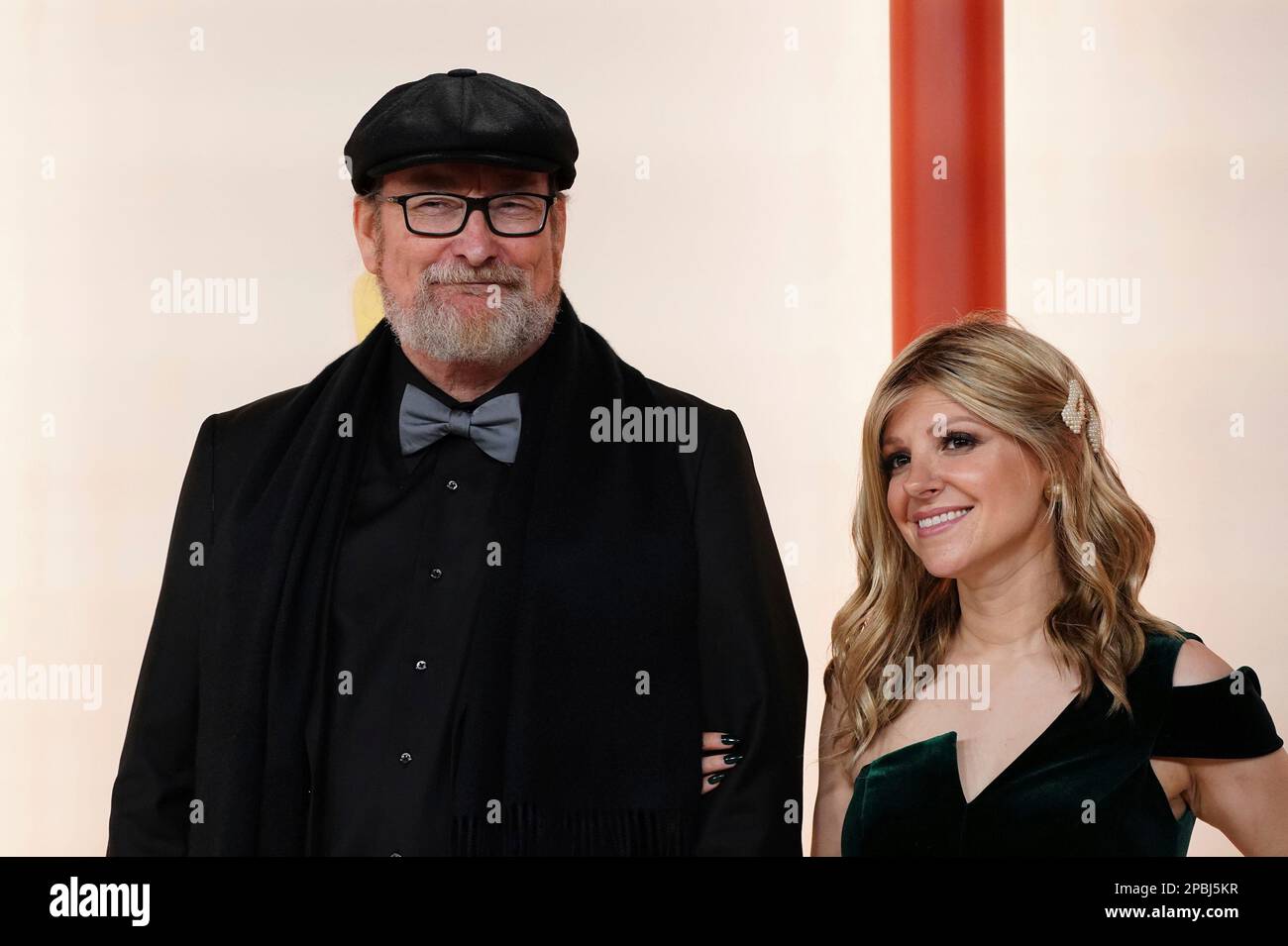 Ian Stokell, left, arrives at the Oscars on Sunday, March 12, 2023, at ...