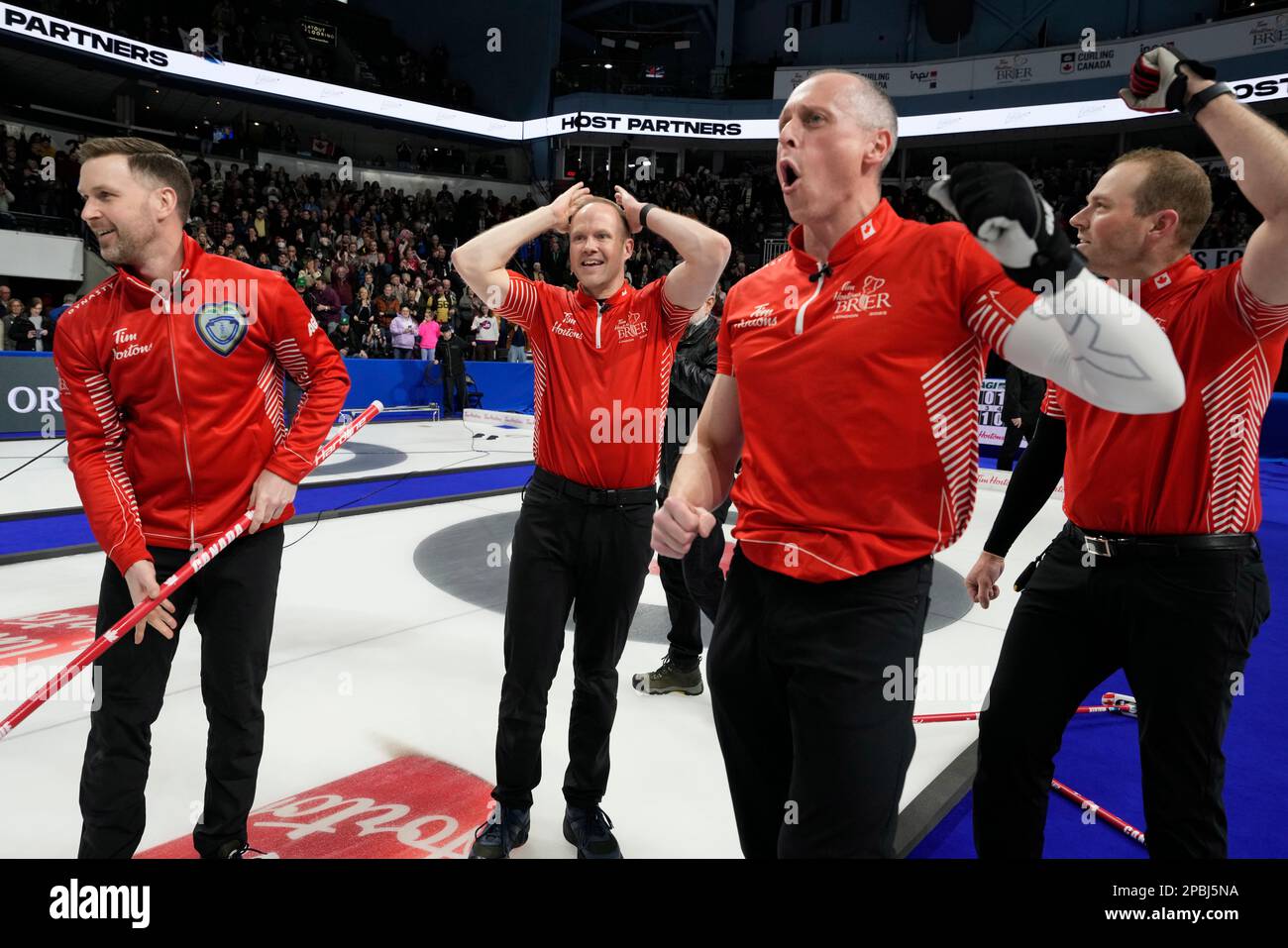 Team Canada skip Brad Gushue, left to right, Mark Nichols, EJ Harnden and Geoff Walker celebrate ...