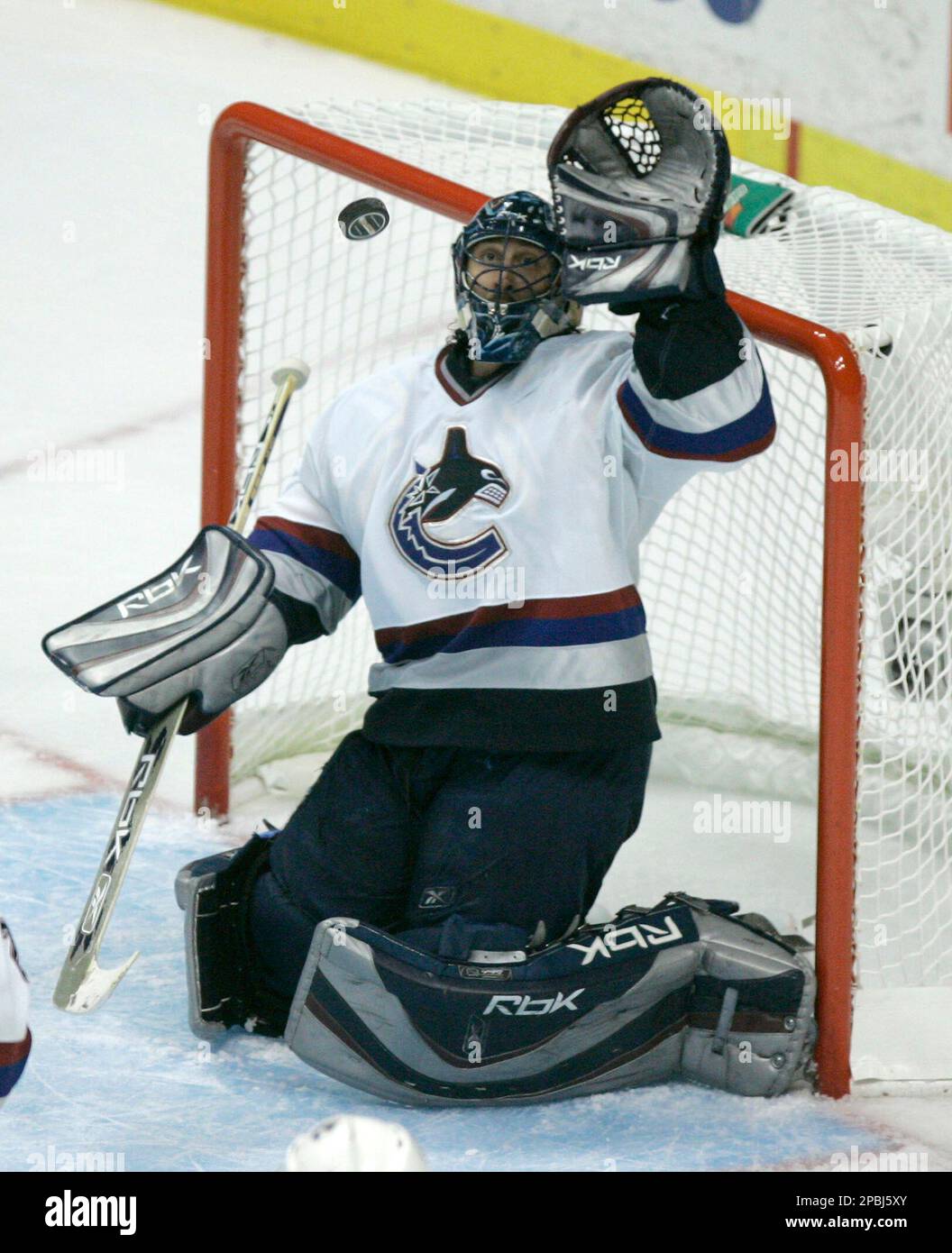 Vancouver Canucks goalie Roberto Luongo makes a save against the ...