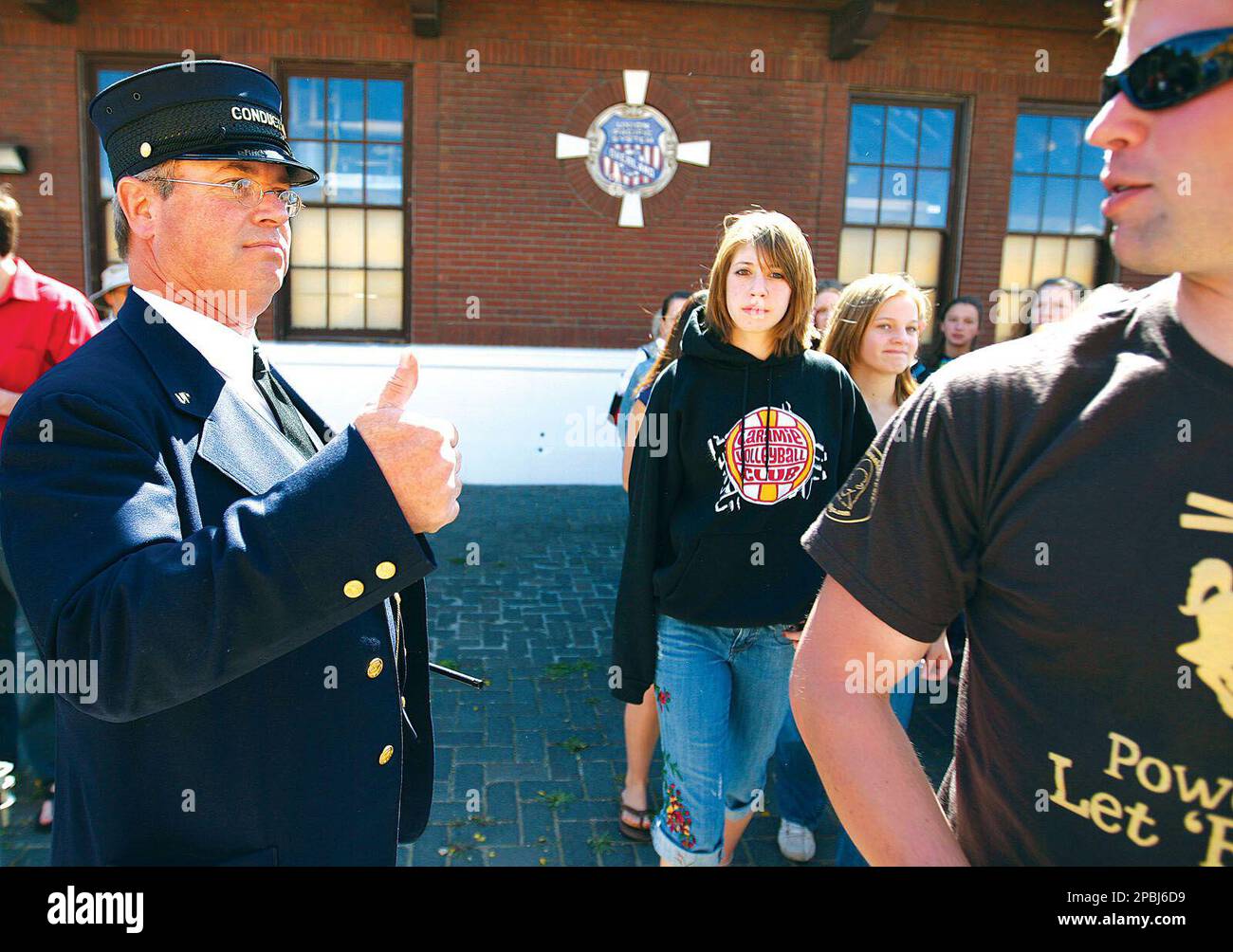Conductor Reed Jackson gives a thumbs up-to passengers before they ...