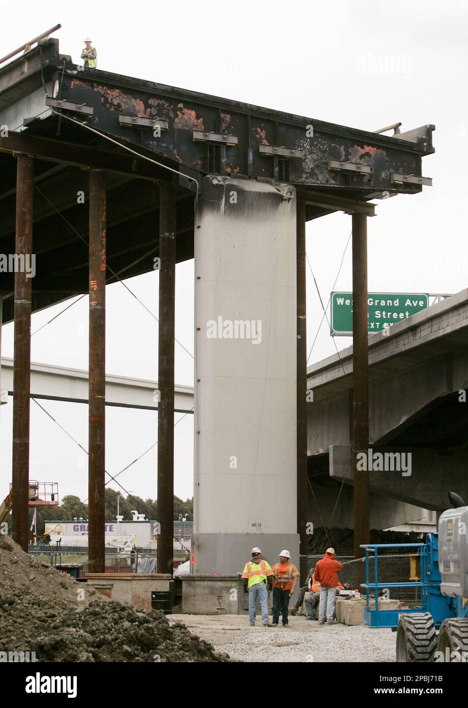Workers repair a collapsed freeway in Oakland, Calif., Thursday, May 3 ...