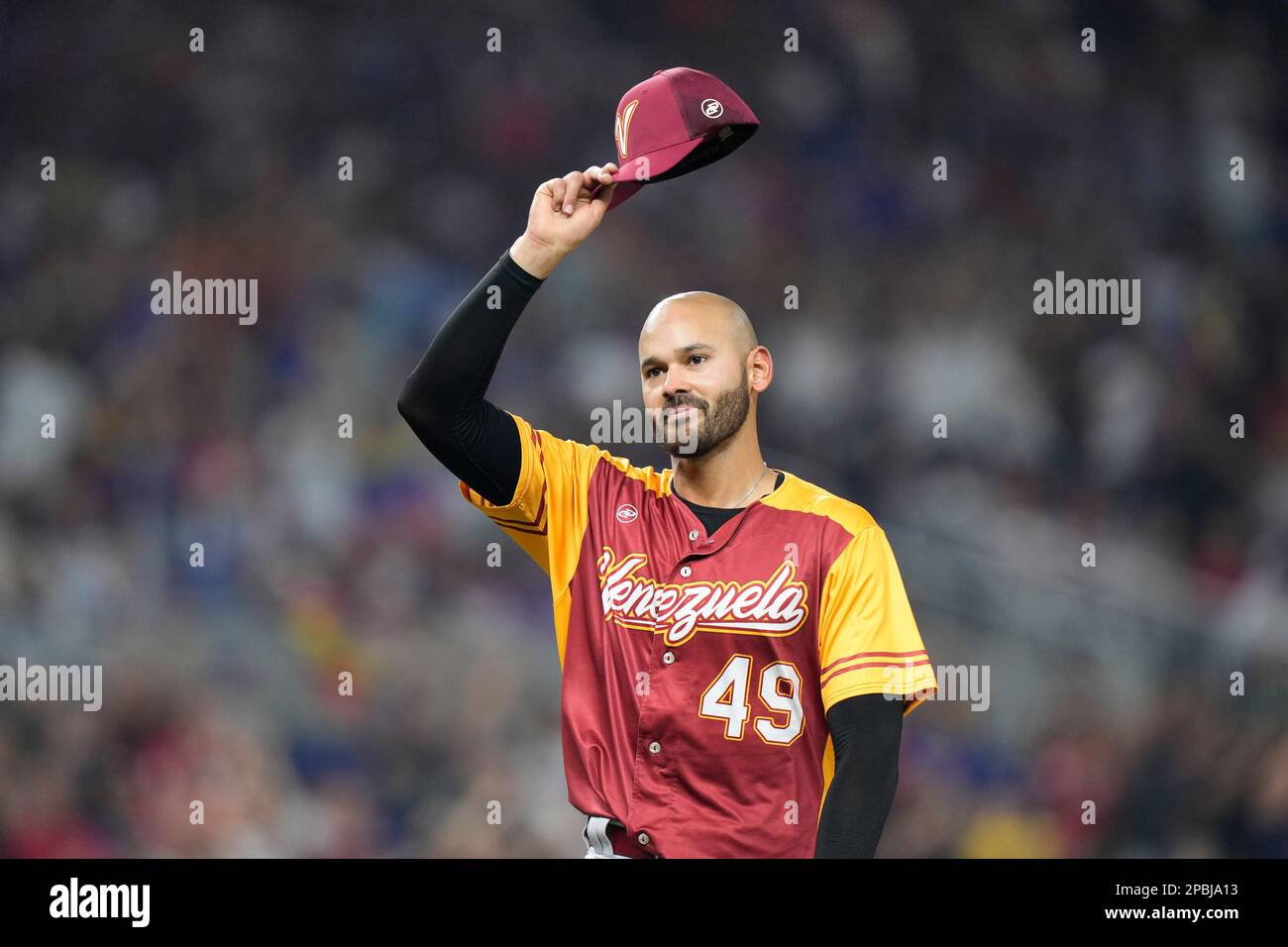 Venezuela pitcher Pablo Lopez tips his hat to the crowd as he is ...