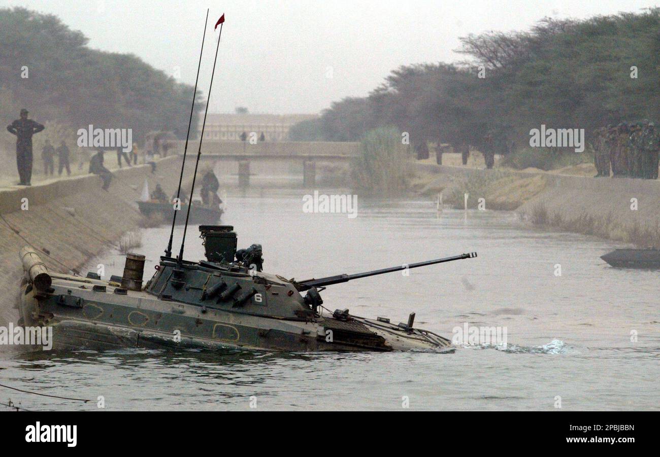 An Indian army's BMP-Infantry combat vehicle crosses a canal during a ...