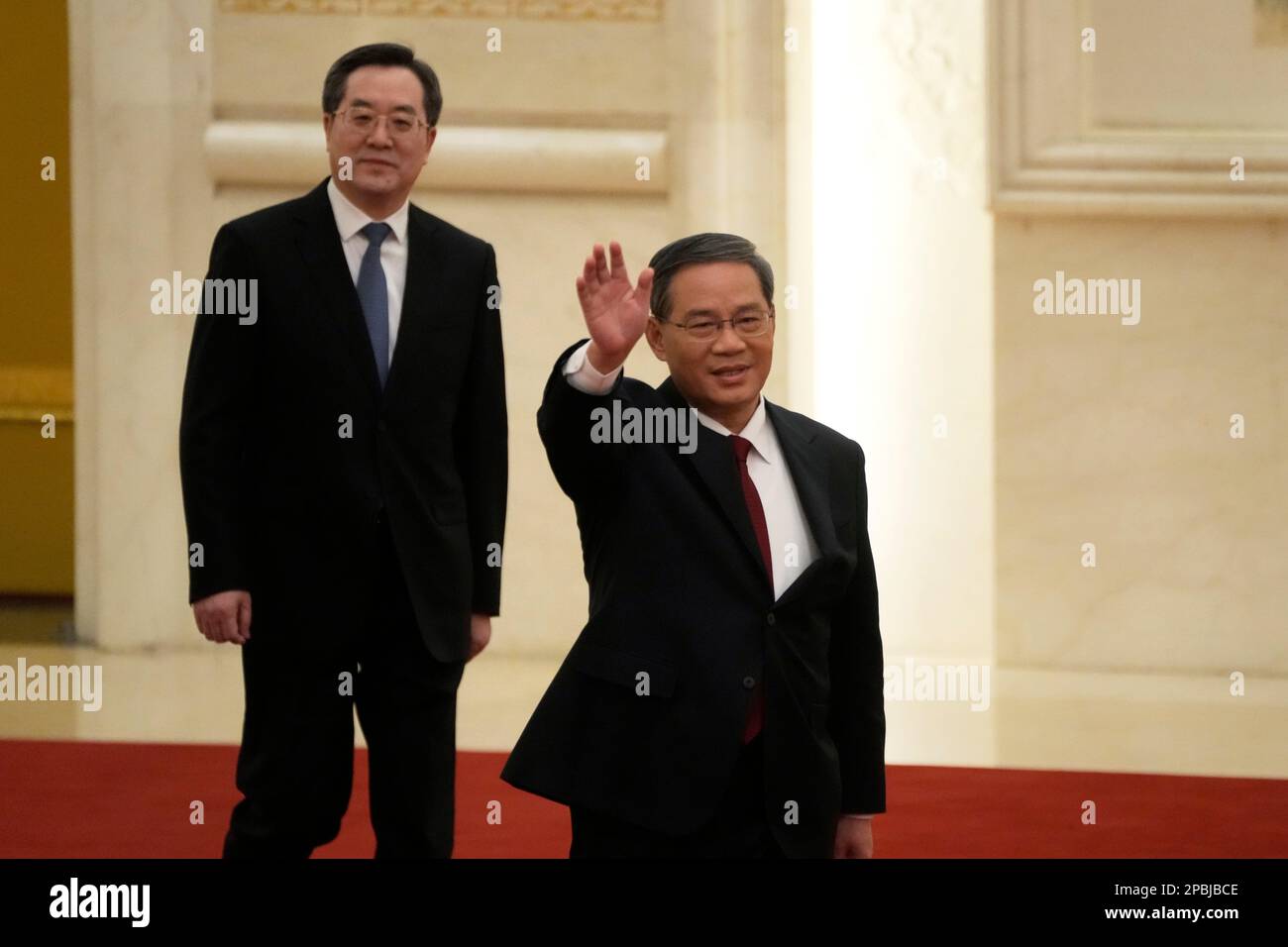 Chinese Premier Li Qiang, waves as he walks ahead of Chinese Vice ...