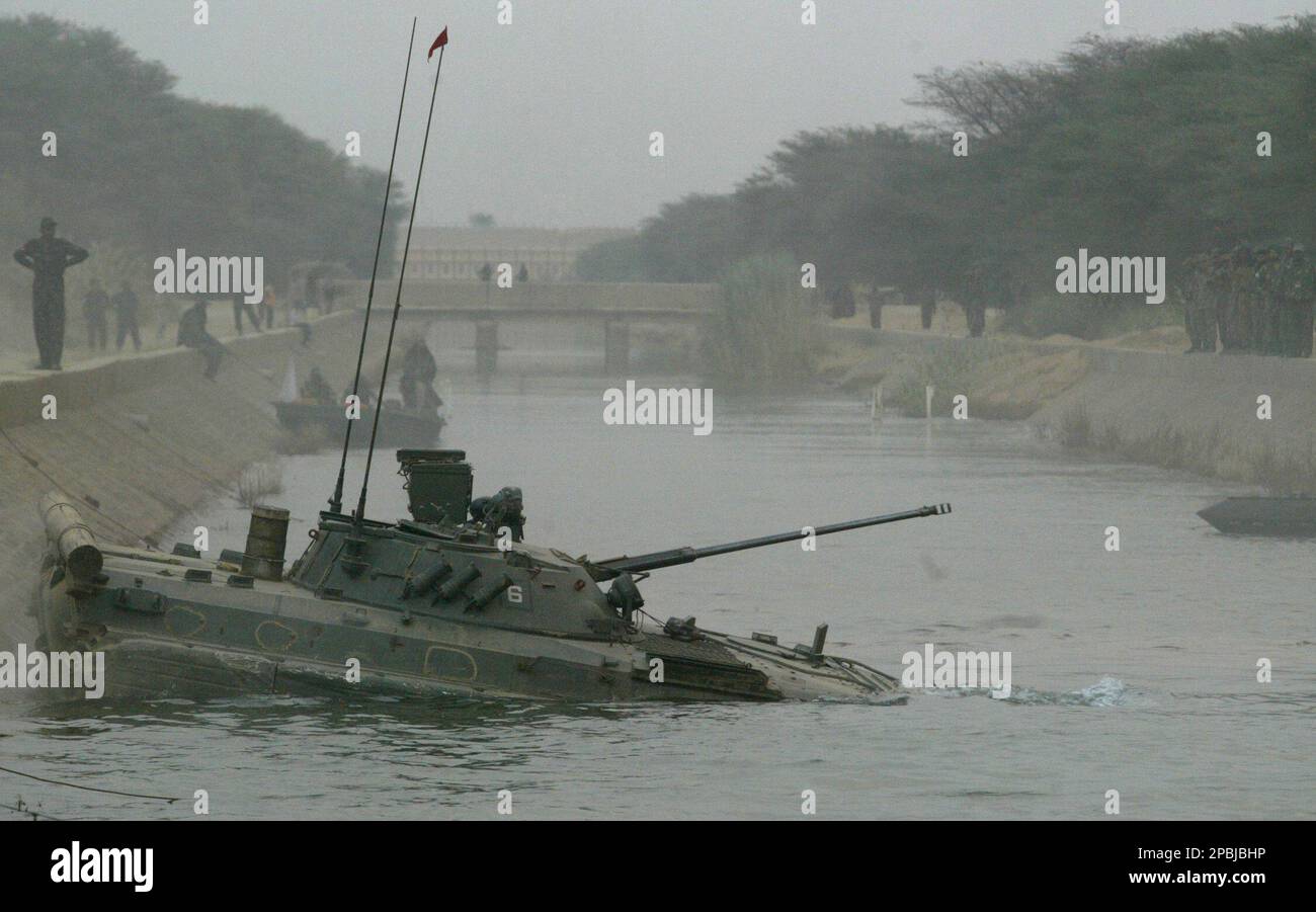 An Indian army's BMP-Infantry combat vehicle crosses a canal during a a ...