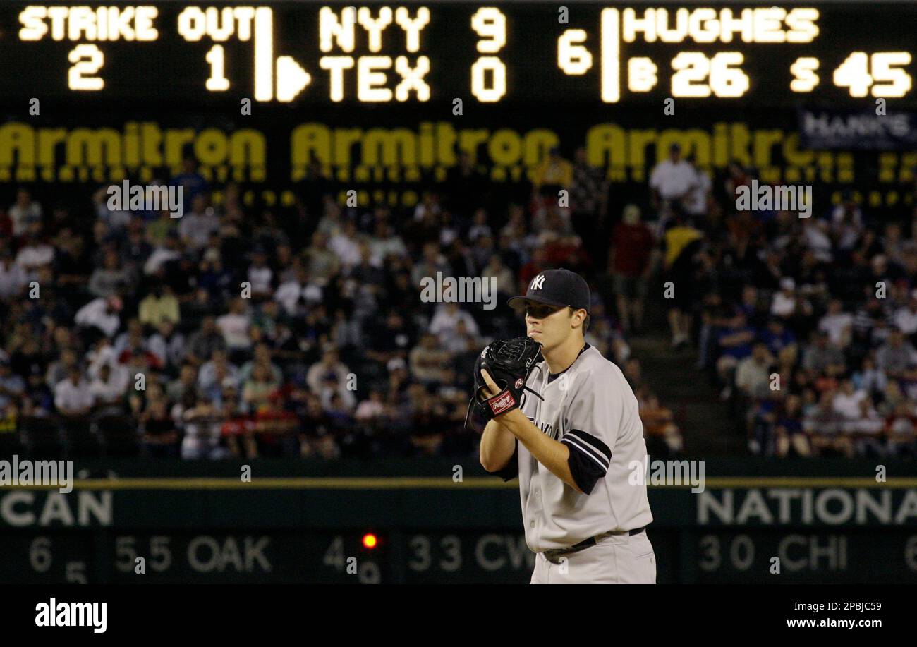 New York Yankees pitcher Phil Hughes faces down a Texas Rangers batter ...