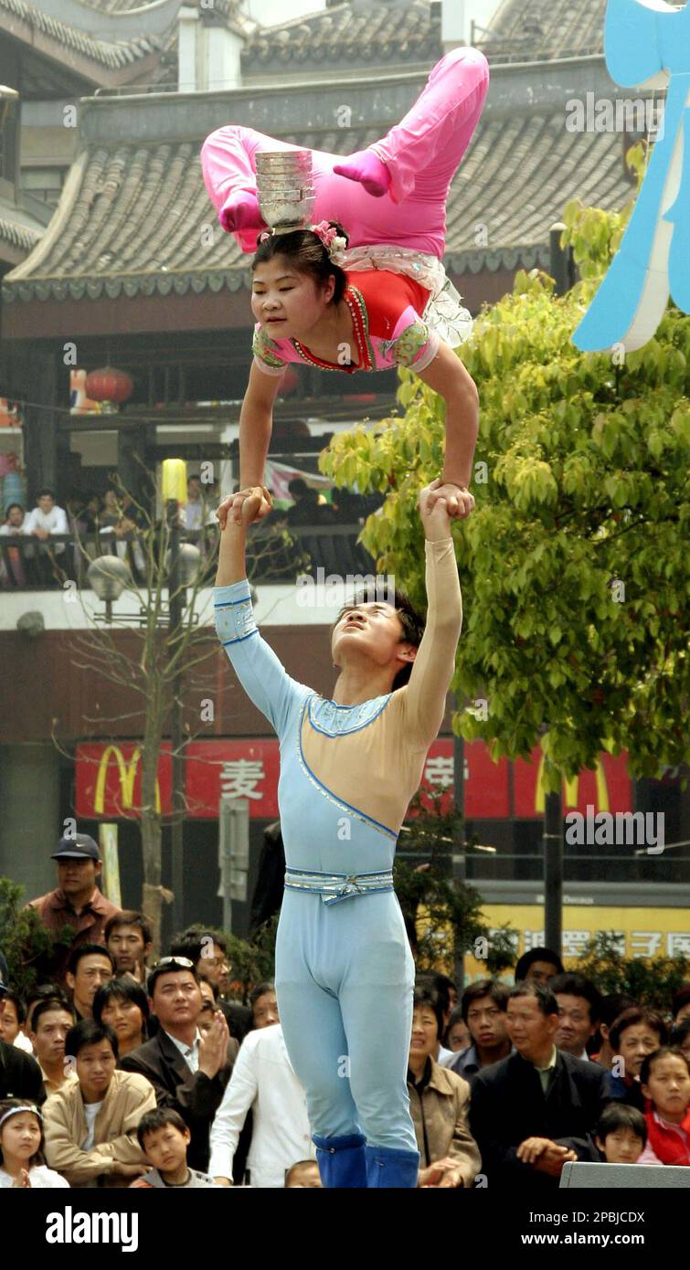 Traditional Chinese acrobat dancers perform at a temple fair Wednesday ...