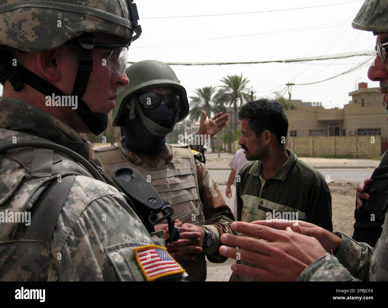 An Iraqi army colonel talks with members of the U.S. Army's Army's 2nd ...