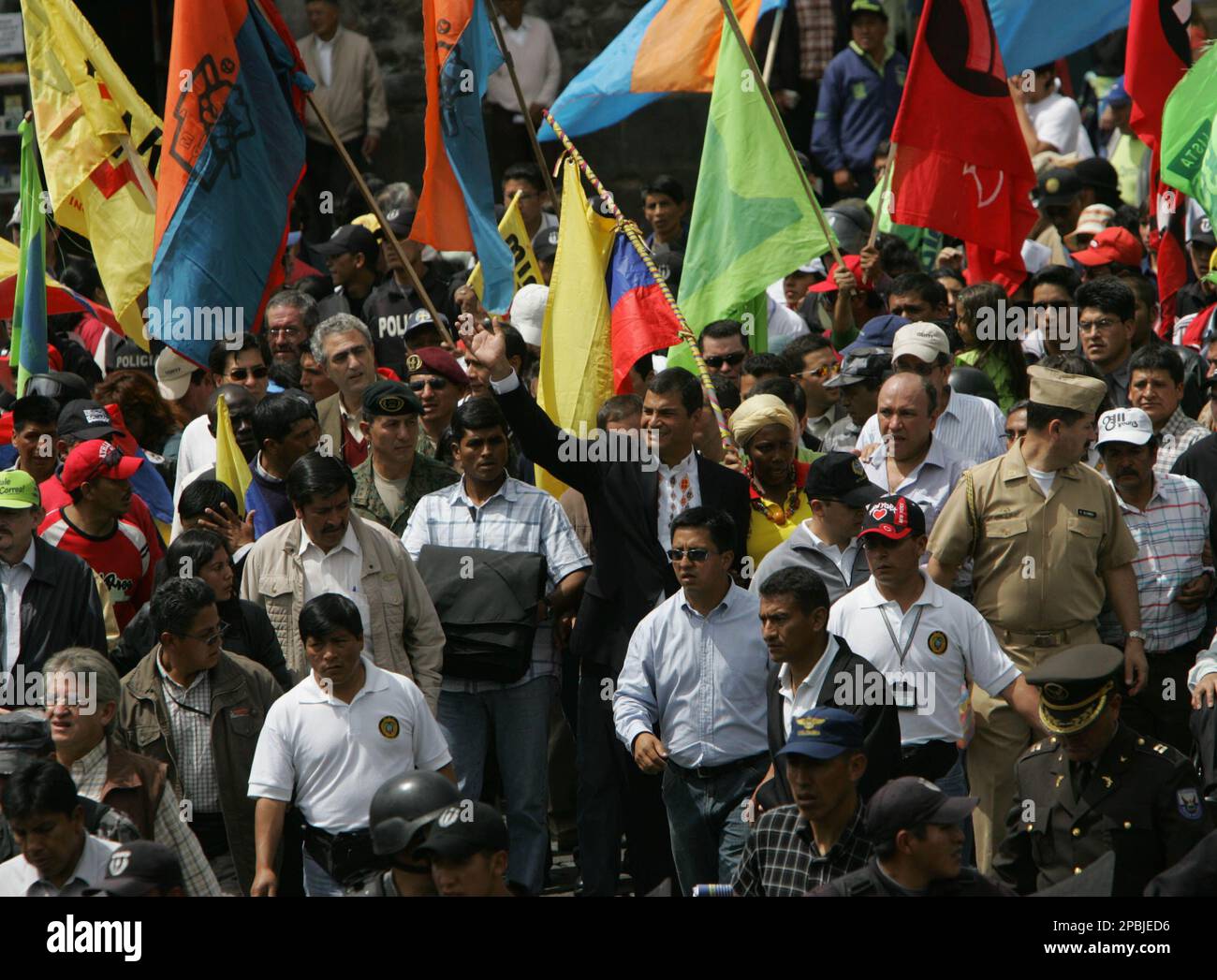 Ecuador's President Rafael Correa waves while marching during May Day ...