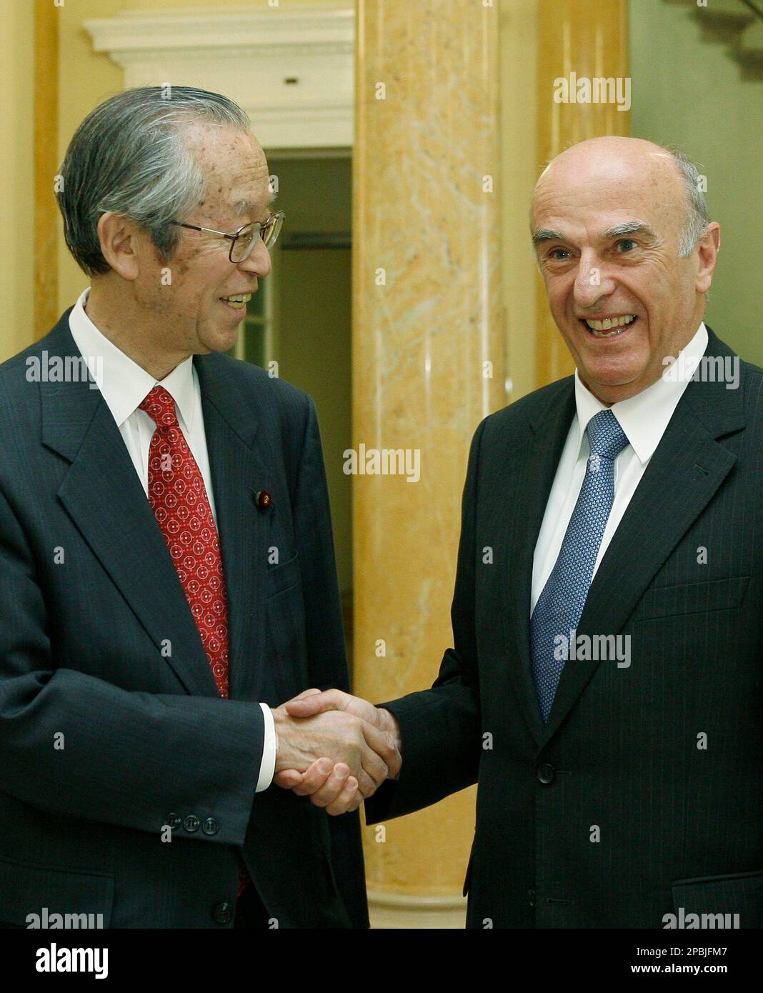 Swiss minister of finance, Hans Rudolf Merz, right, welcomes his ...