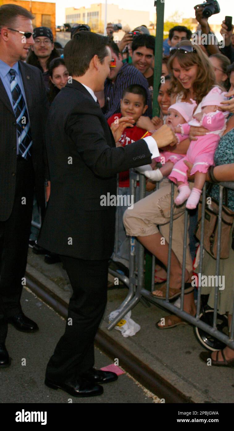 Actor Tobey Maguire greets fans as he arrives for the premiere of ...
