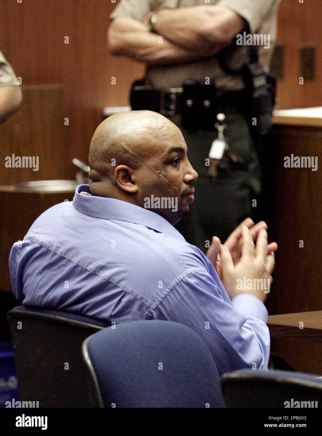 Chester Turner is shown listening as a guilty verdict is read during ...
