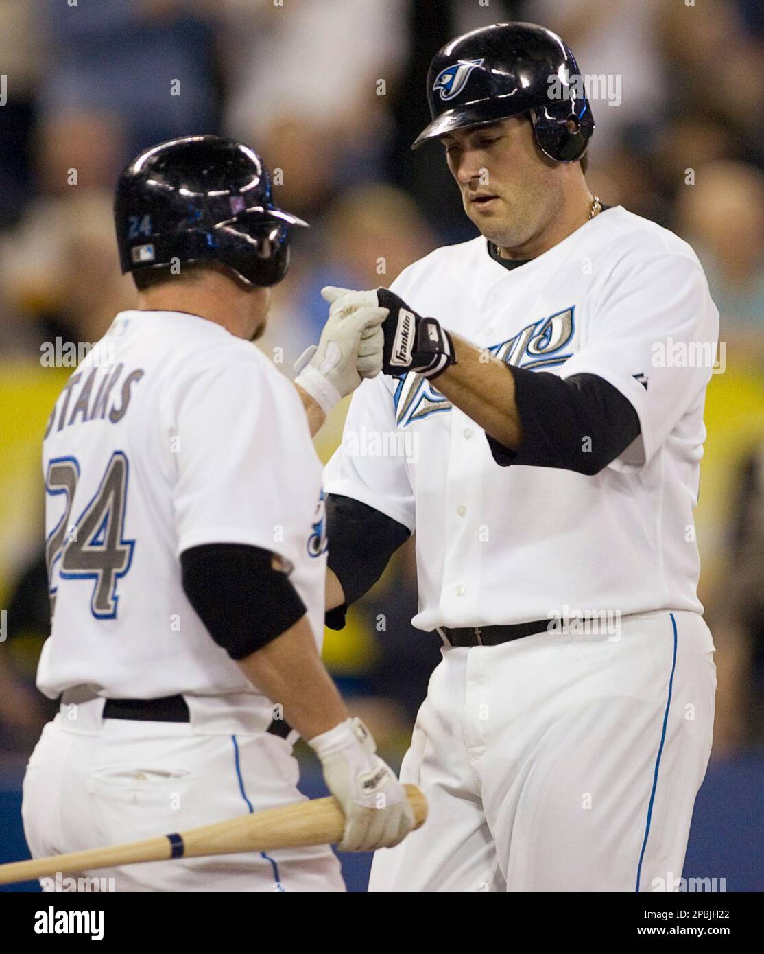 Toronto Blue Jays' Matt Stairs, left, congratulates Troy Glaus on his ...