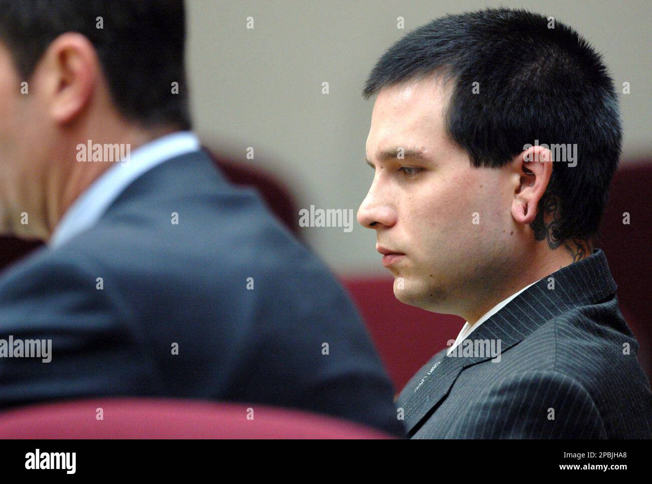Michael Kozlowski, right, sits next to his defense attorney Daniel Haws ...