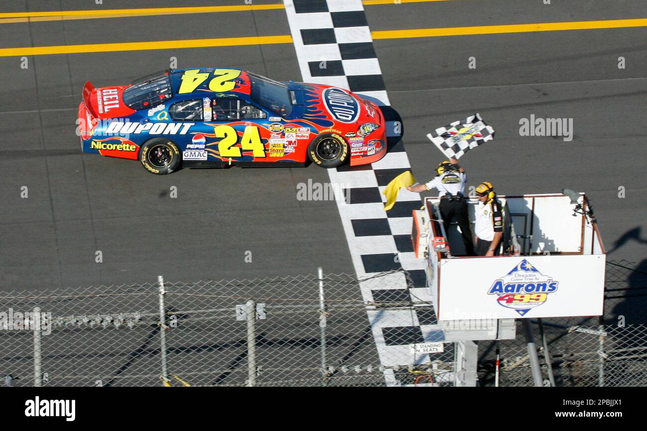 Jeff Gordon crosses the finish line to win the NASCAR Aaron's 499 auto ...