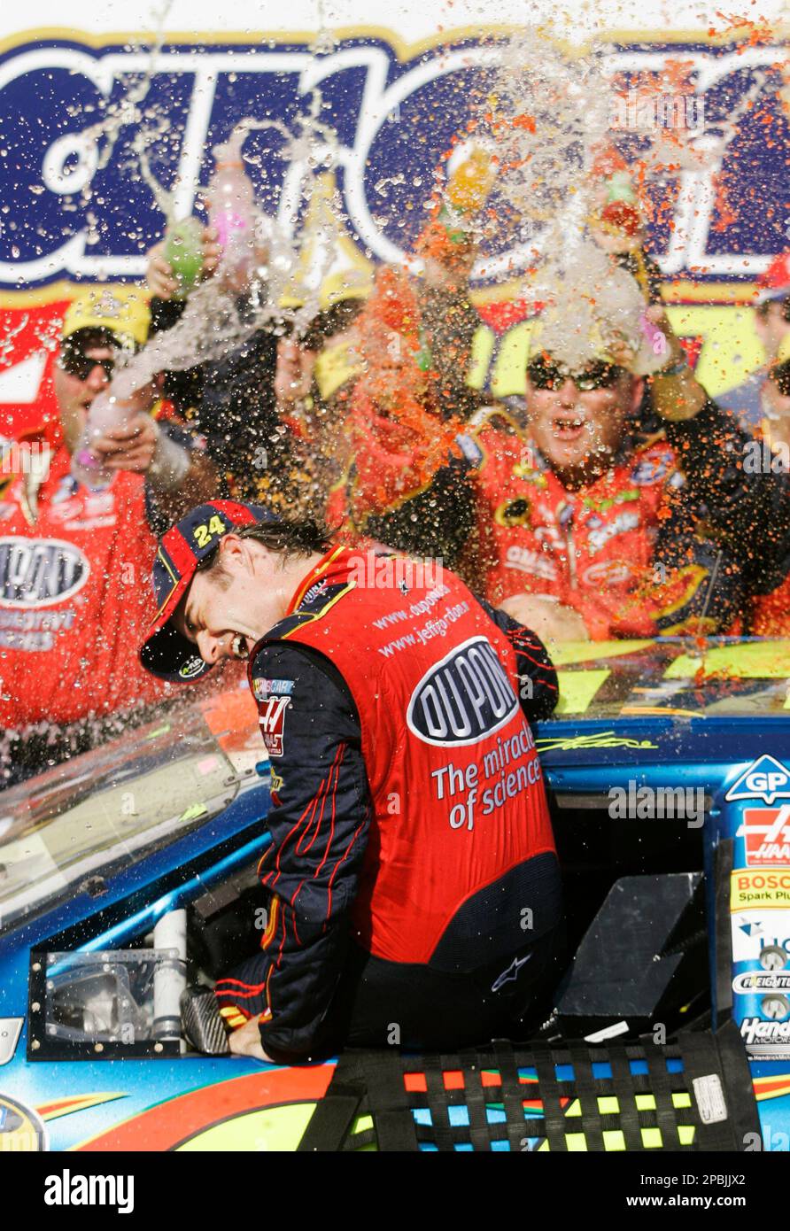 Jeff Gordon celebrates in victory lane after winning the NASCAR Aaron's ...