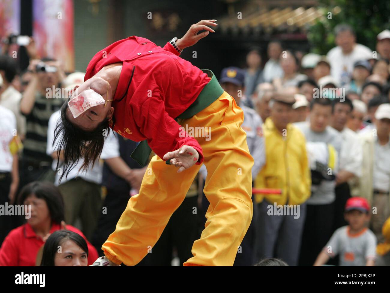 A dancer performs at the Pao-An Temple marking the 267th birthday of ...