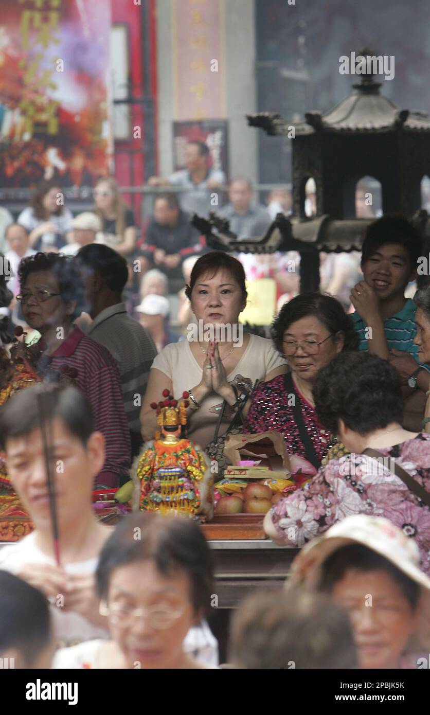 Worshippers offer prayers at the Pao-An Temple marking the 267th ...