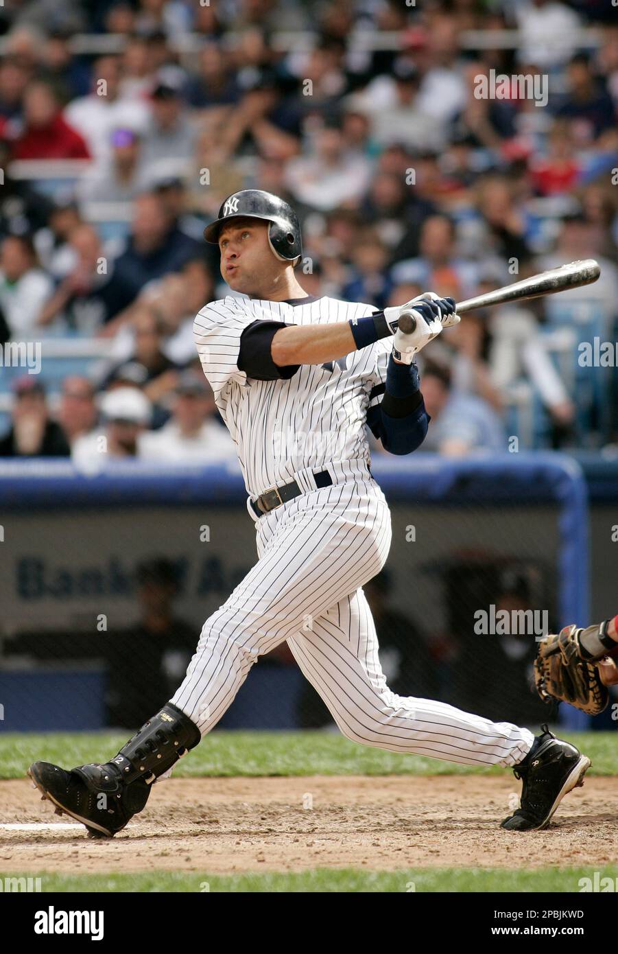 New York Yankees' Derek Jeter hits a solo home run against the Boston ...