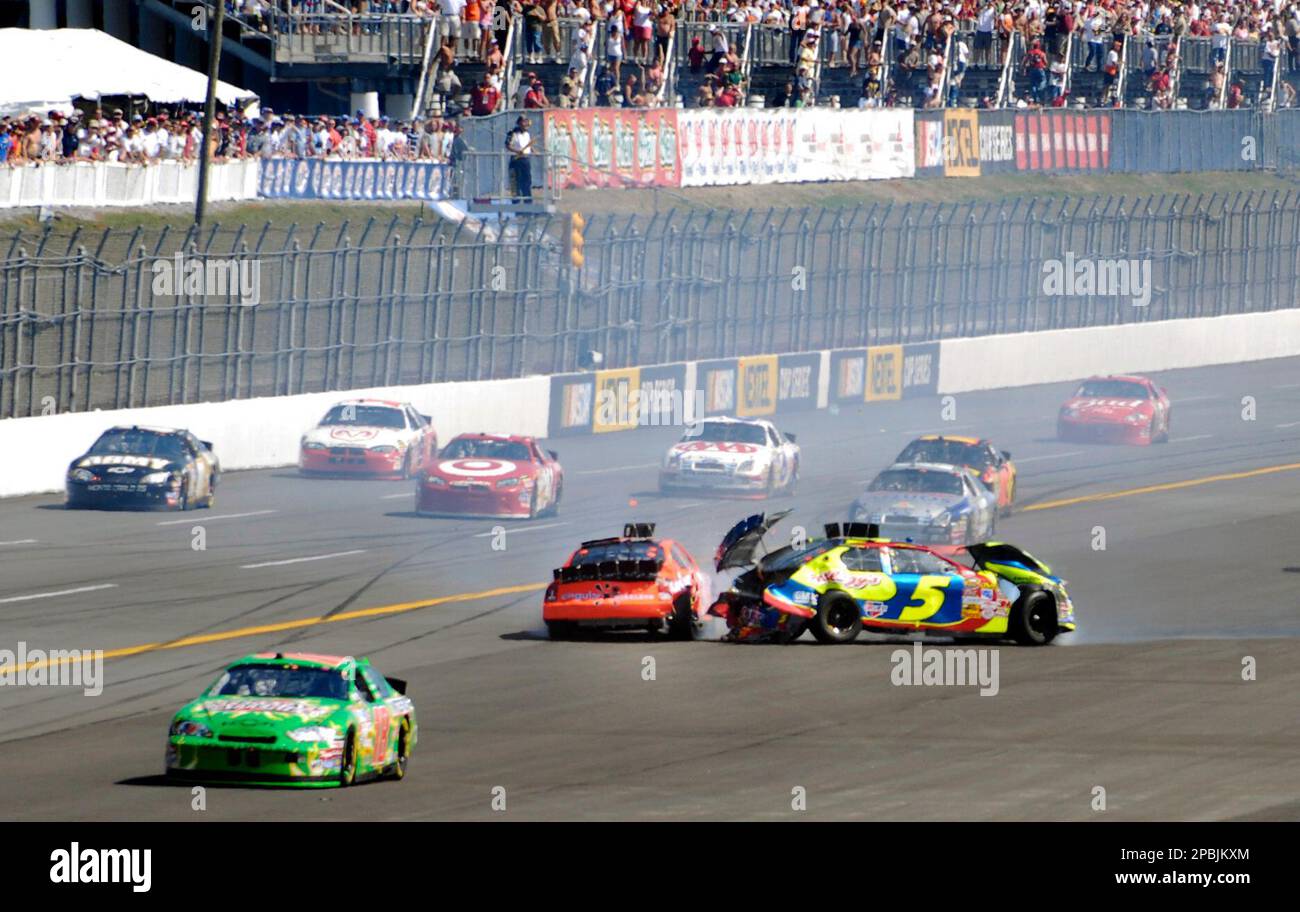 Jeff Burton, center, and Kyle Busch (5) crash on the back stretch on ...
