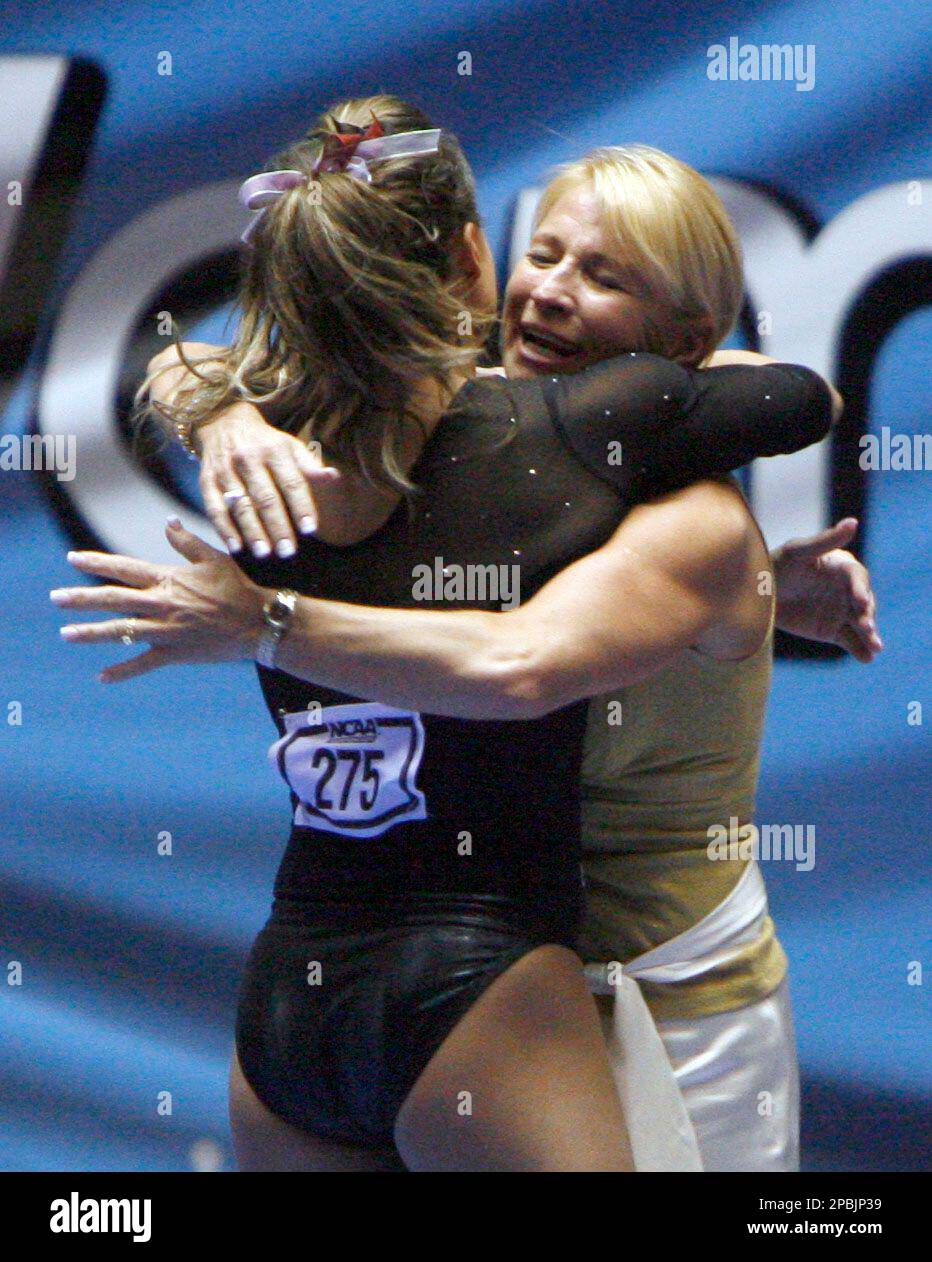 Utah's Ashley Postell gets a hug from coach Megan Marsden, after her ...