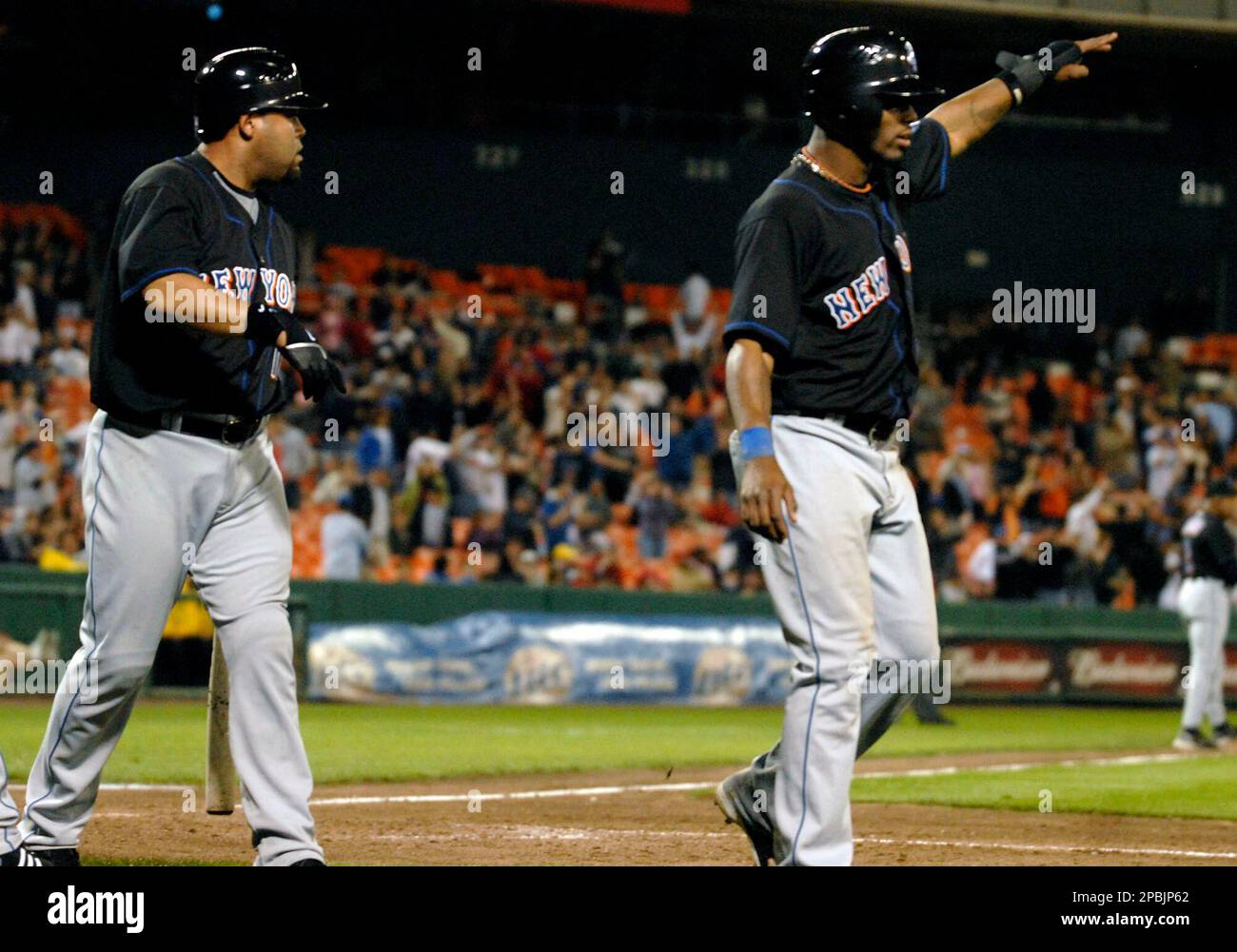 New York Mets' Ramon Castro, left, and Jose Reyes, right, head to the ...