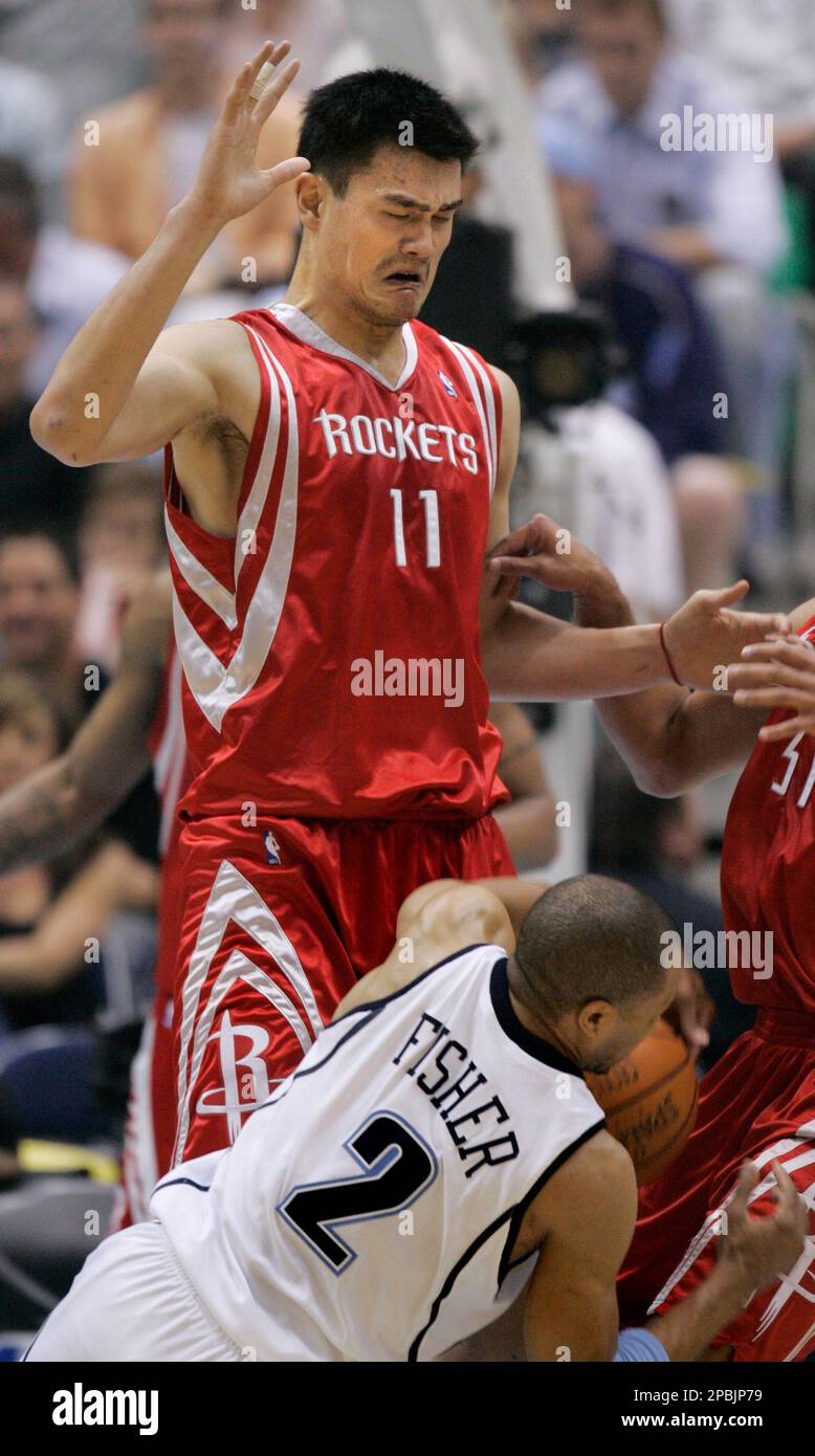 Utah Jazz guard Derek Fisher (2) goes down to the floor after being ...