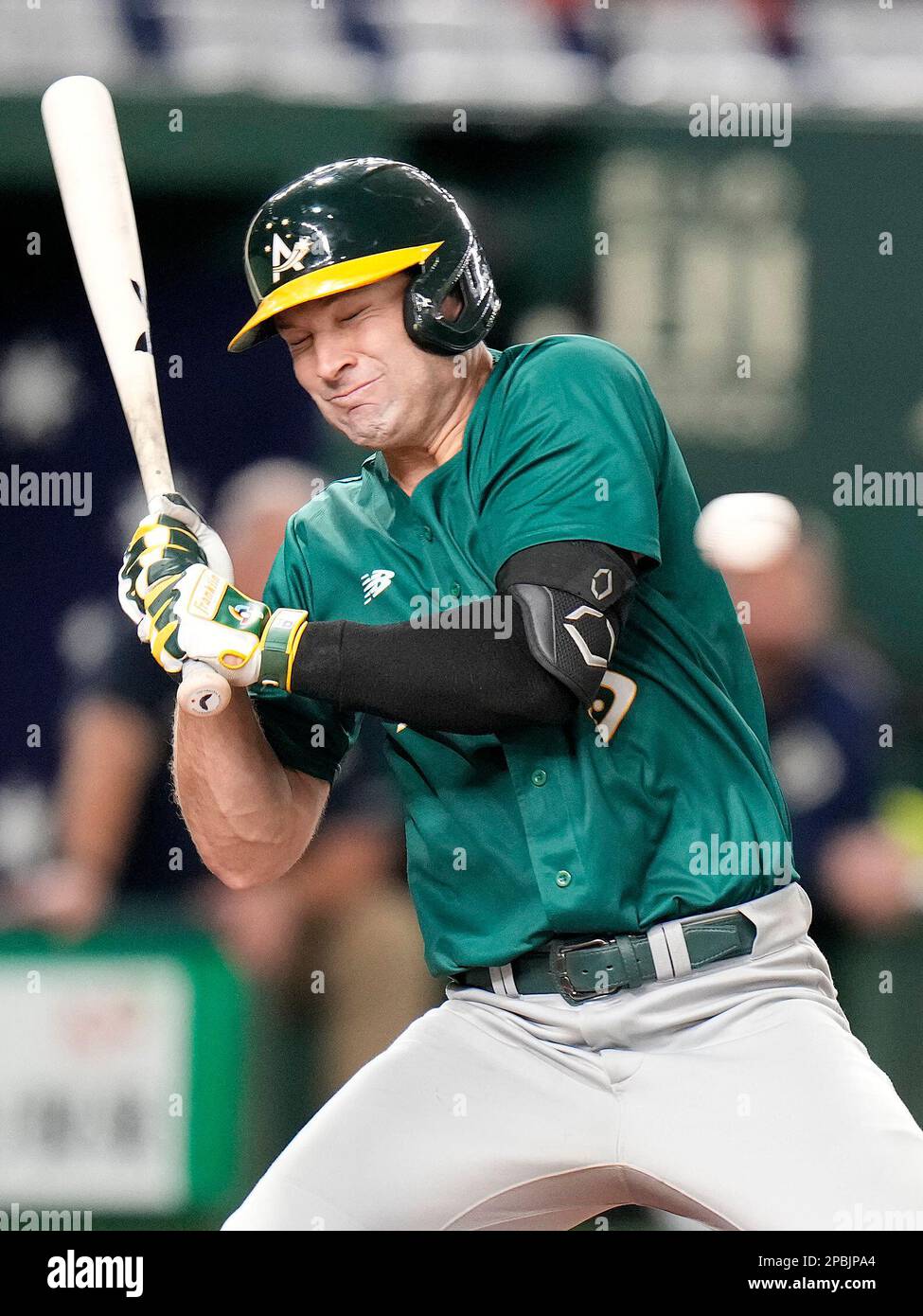 Timothy Kennelly of Australia grimaces as a high ball from Martin ...