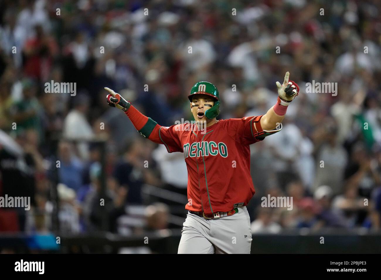 Mexico's Joey Meneses celebrates as he runs the bases after hitting a ...