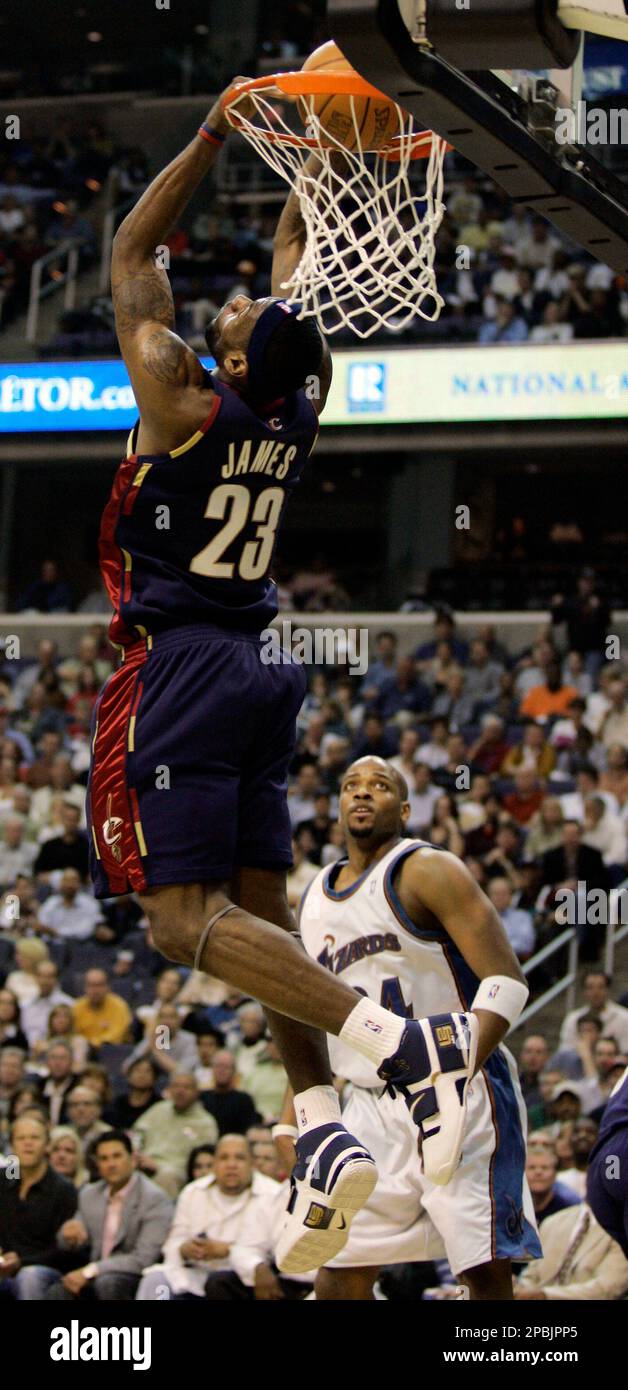 Cleveland Cavaliers' LeBron James, top, dunks as Washington Wizards's ...