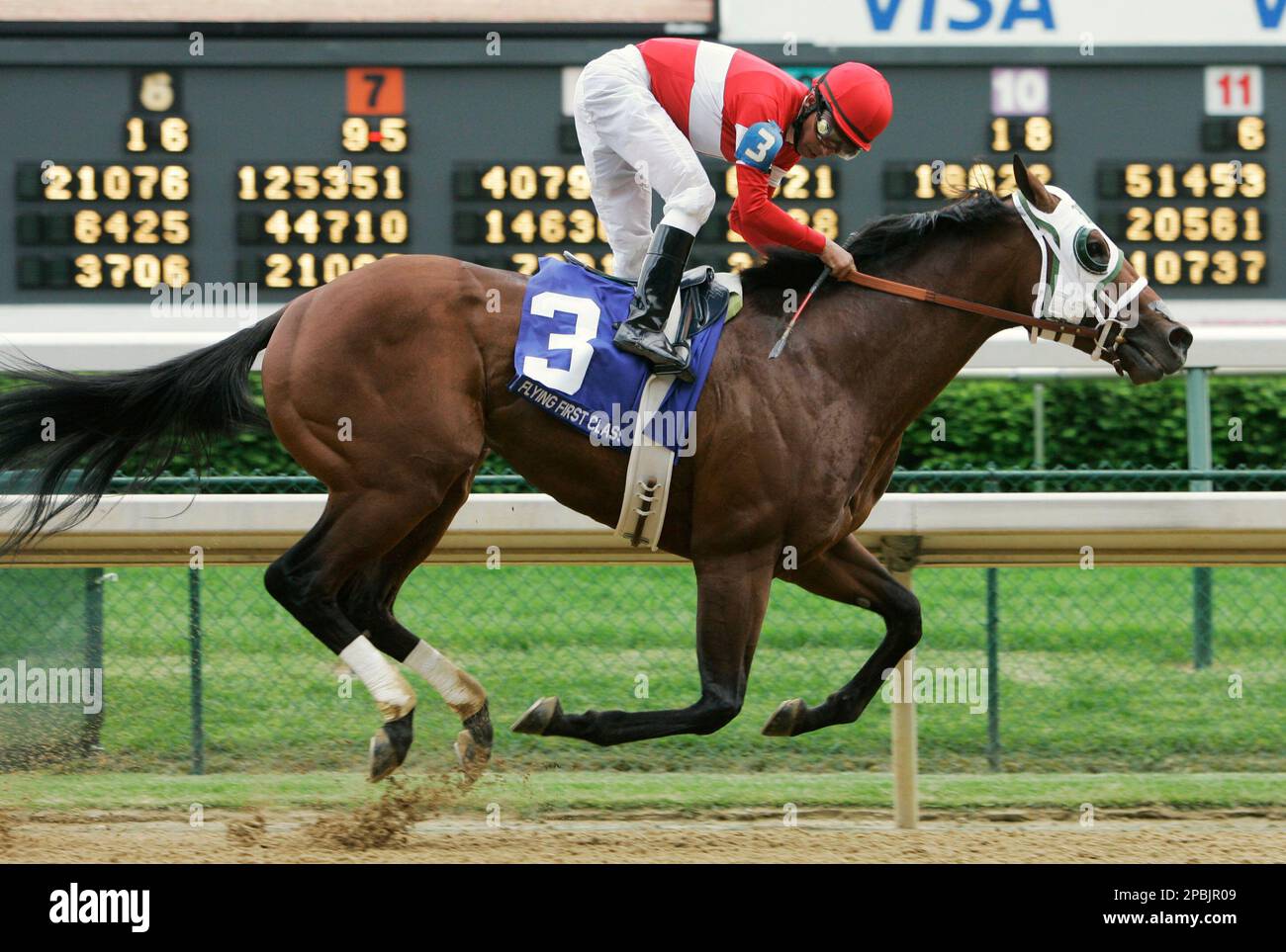 Jockey Mark Guidry comes out of the saddle after guiding Flying First ...