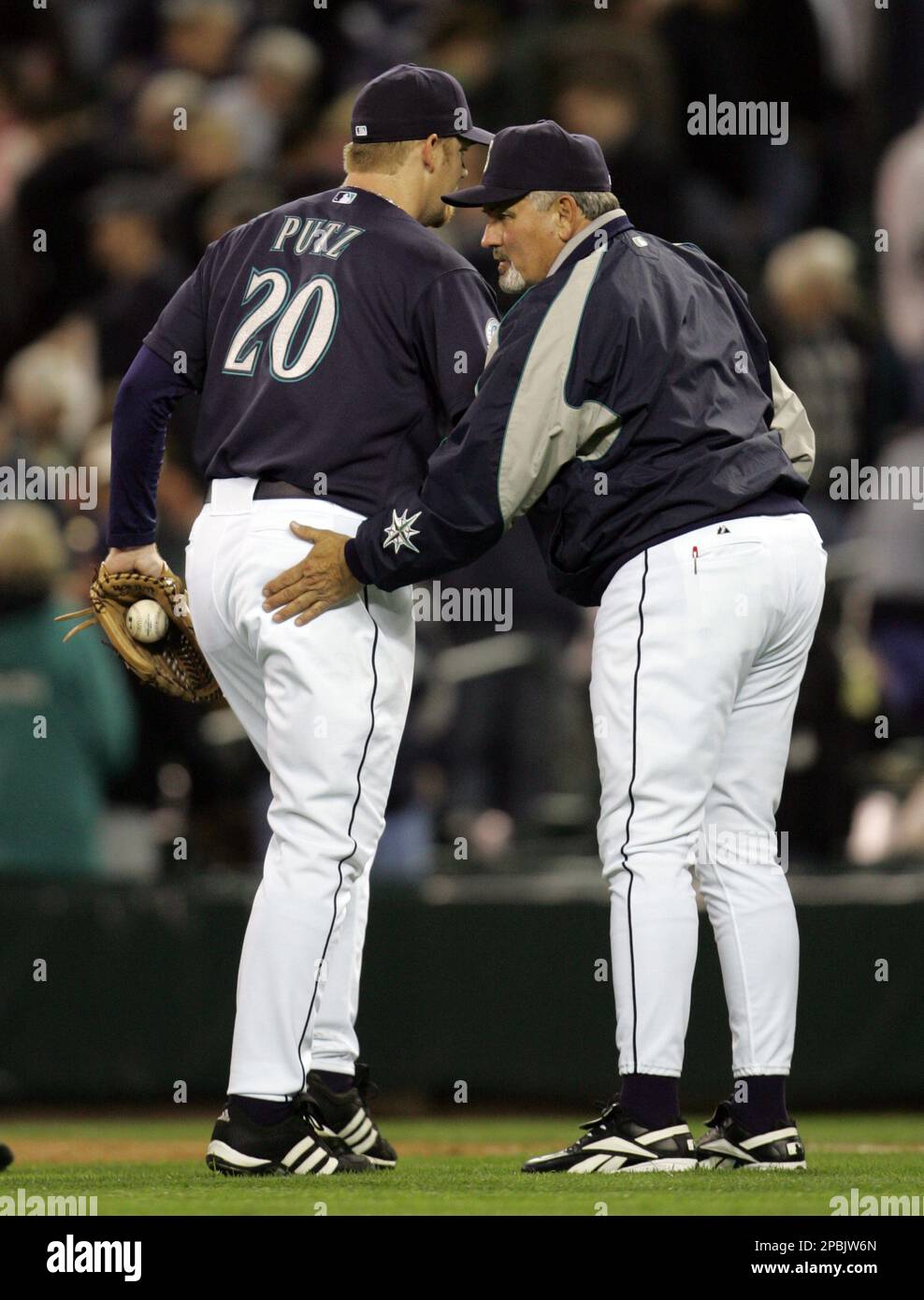 Seattle Mariners manager Mike Hargrove, right, congratulates closing ...