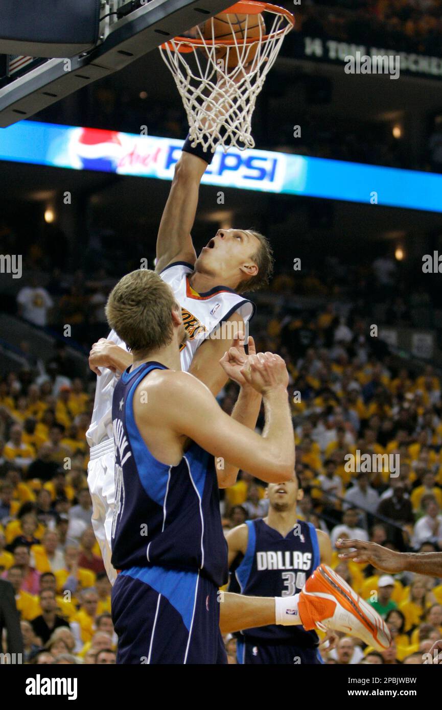 Golden State Warriors' Andris Biedrins, right, of Latvia, scores over ...