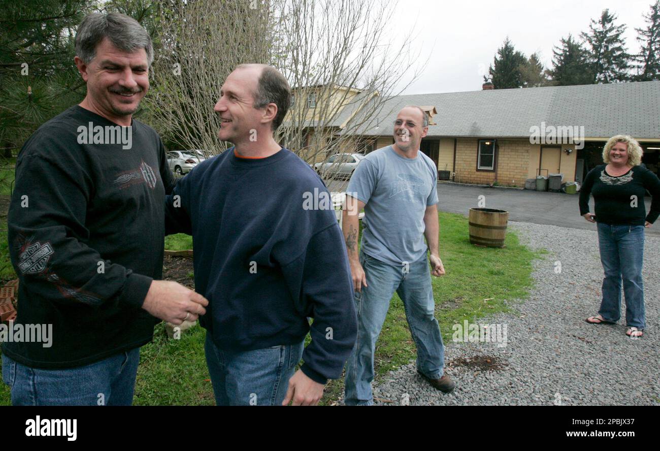 Clarence Elkins, left, congratulates Randy Resh and Robert Gondor as ...