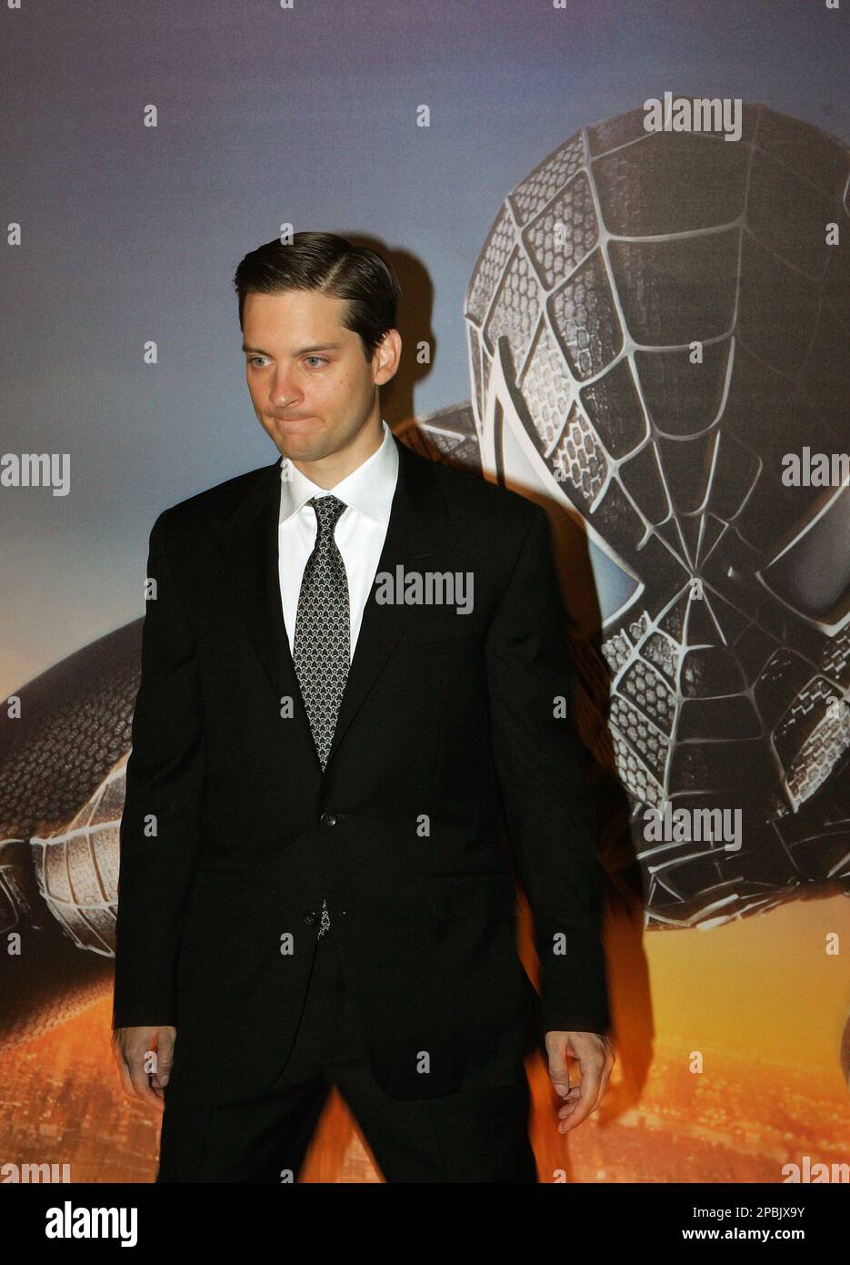 US actor Tobey Maguire poses for photographers as he stands in front of ...