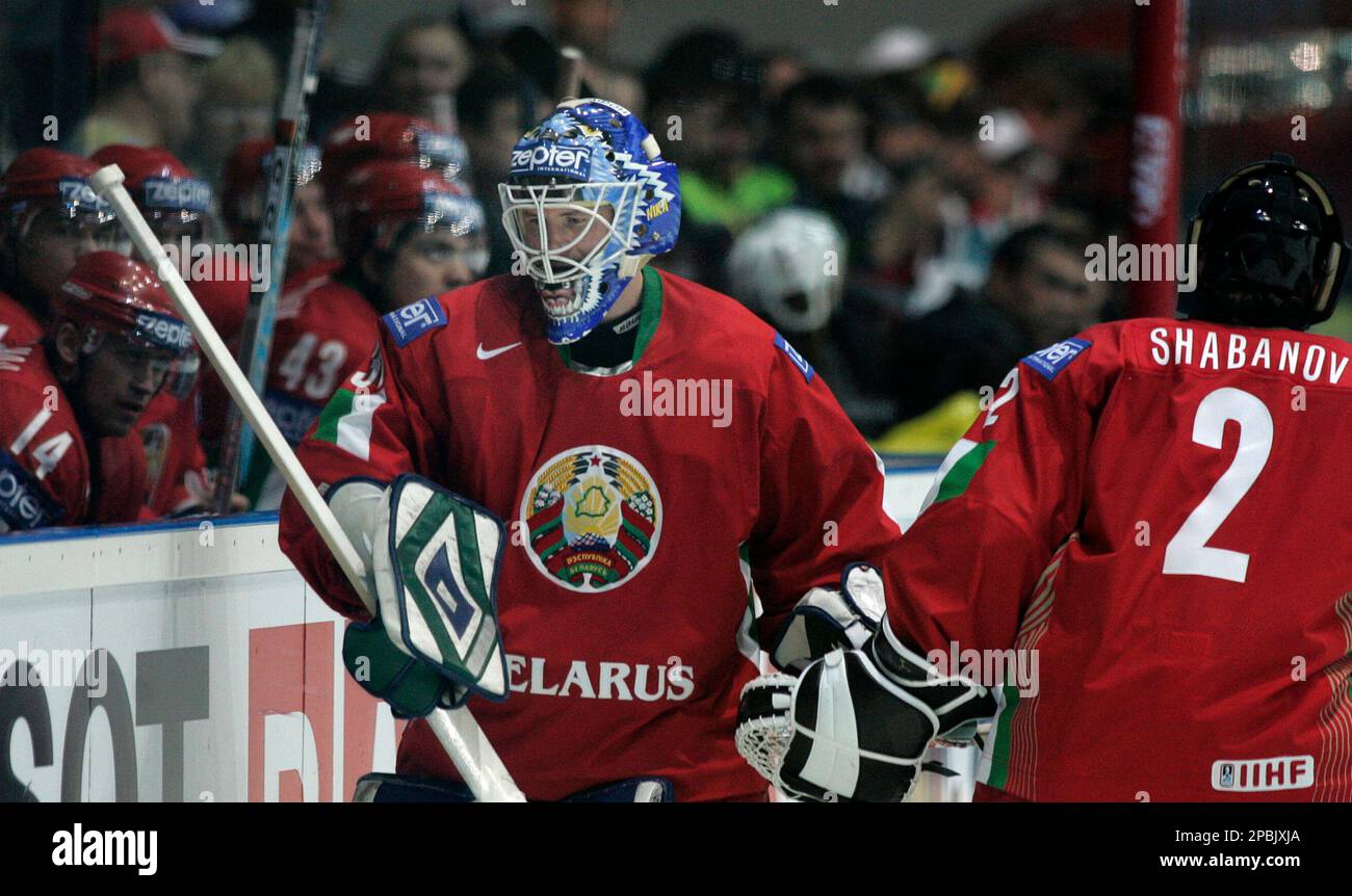 Belarus' goalkeeper Andrei Mezin, center, reacts going to the bench ...