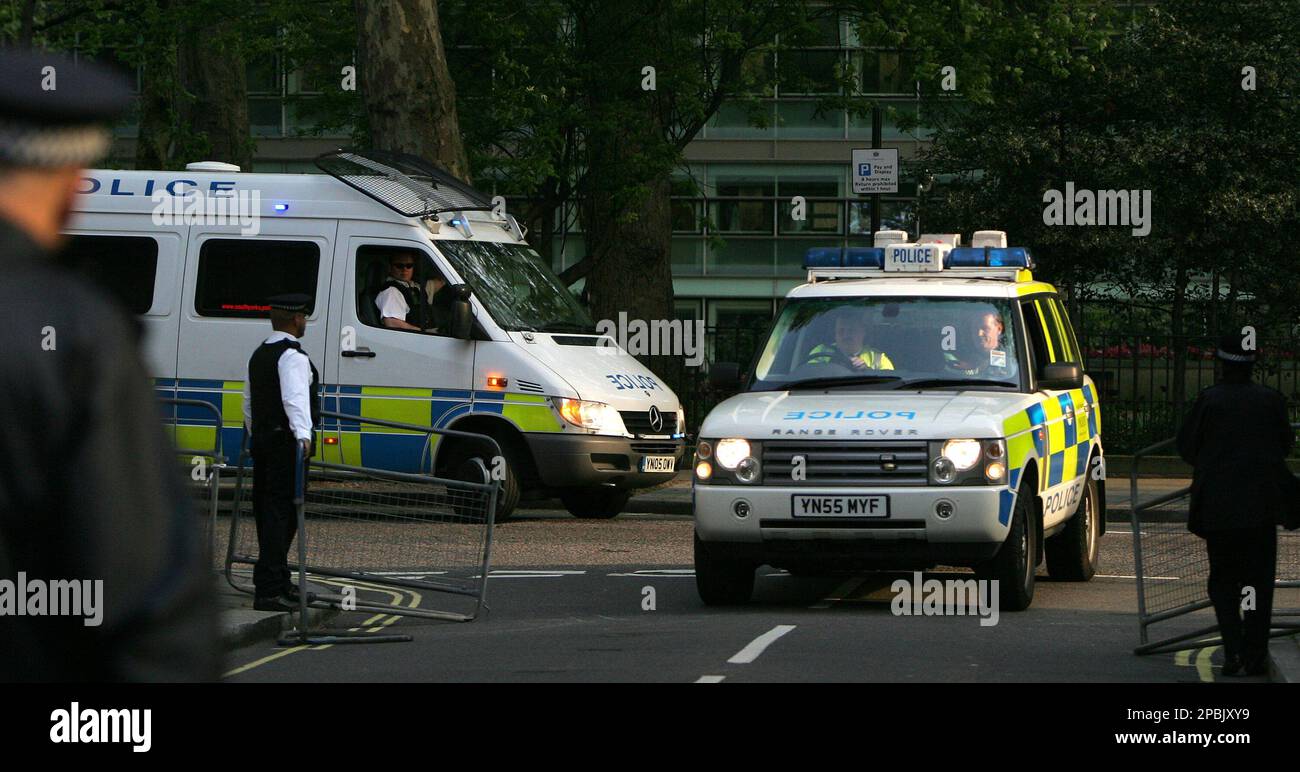 Armed Police escort three vans as they arrive at Westminster Court in ...