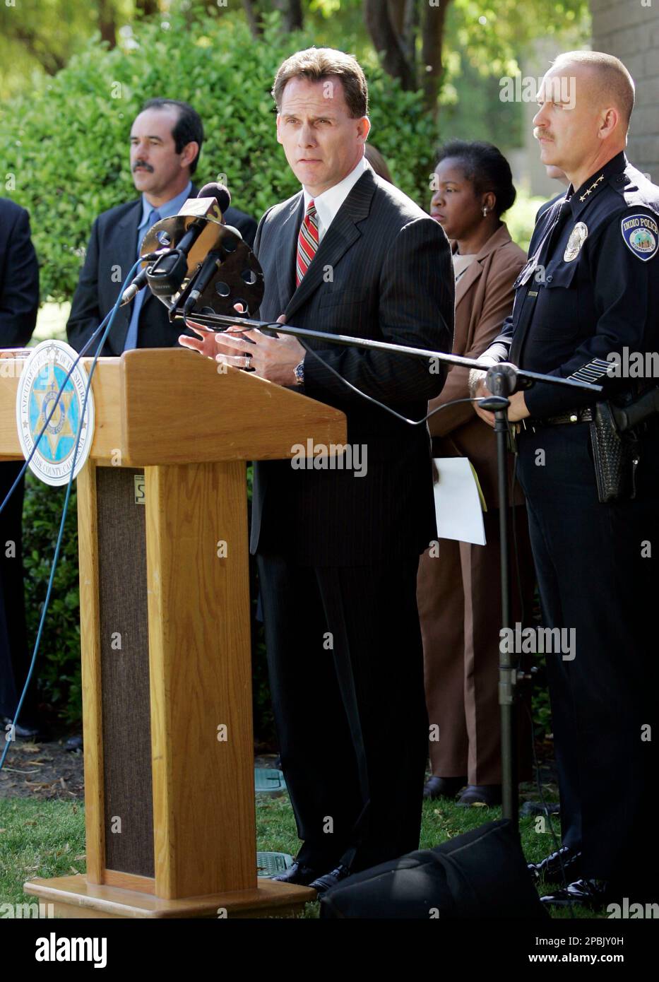 FBI Special Agent Herb Brown, center, speaks at a podium at a news ...