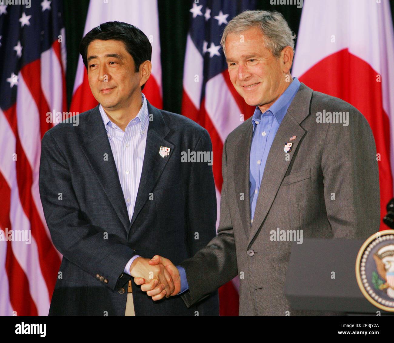 President Bush, right, shakes hands with Japanese Prime Minister Shinzo ...