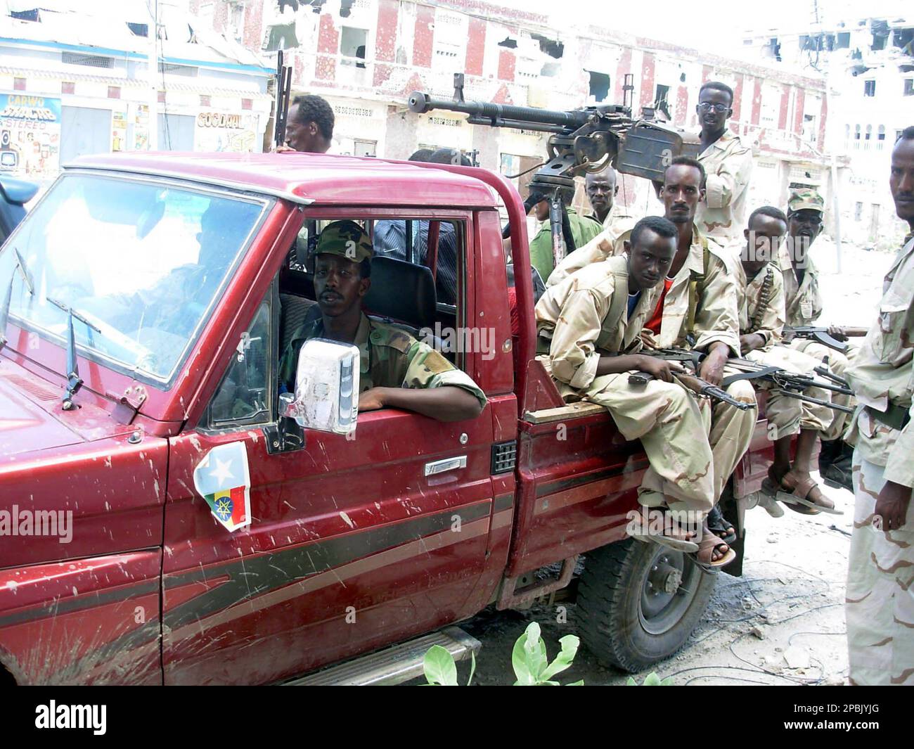 Somali Transitional Federal Soldiers with an anti aircraft gun mounted ...