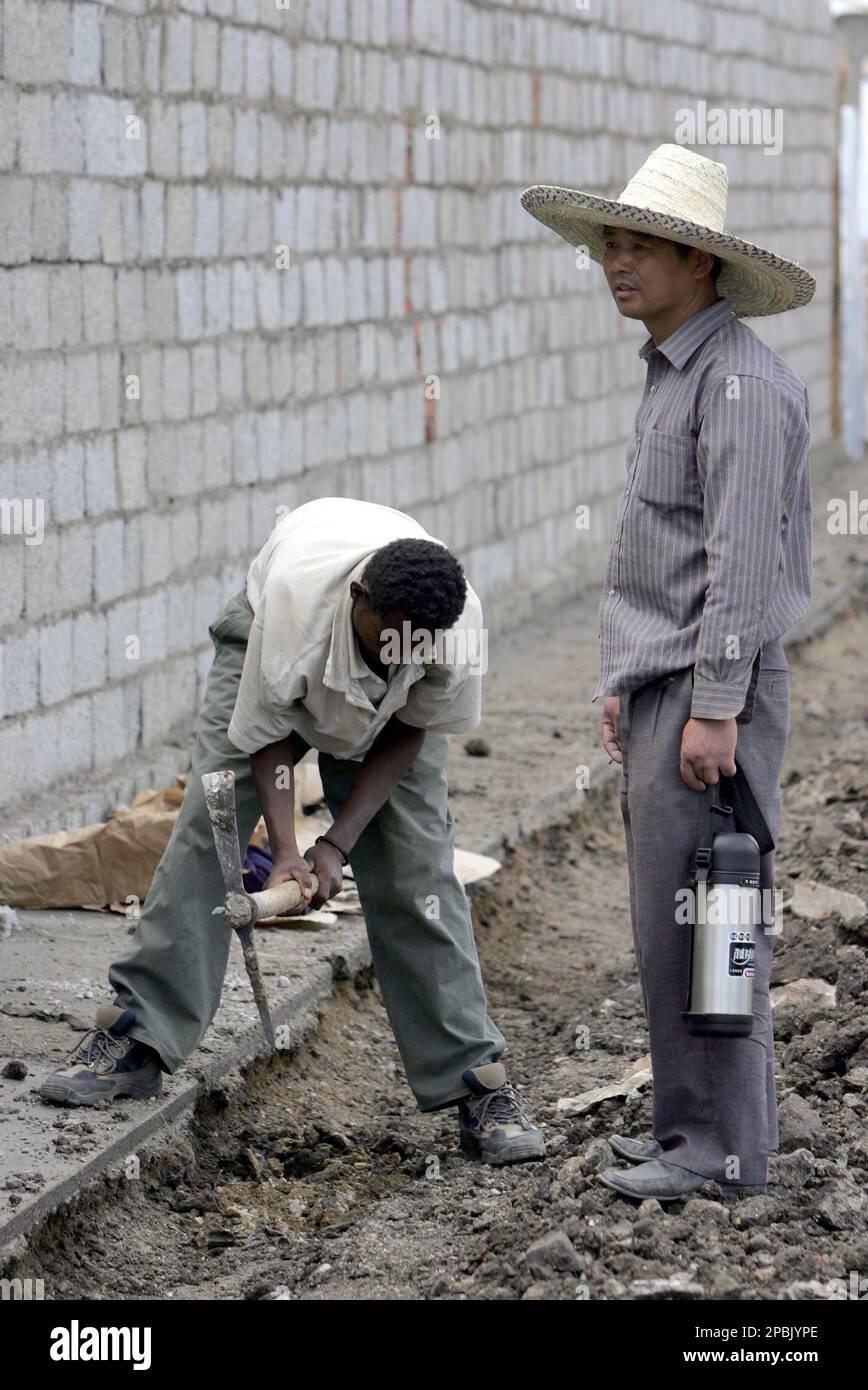 A Chinese construction worker from the Shanghai Construction Group ...