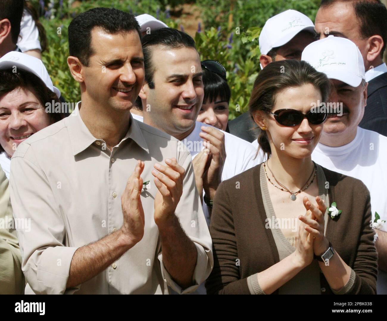 Syrian President Bashar al-Assad and his wife Asma visit an ...
