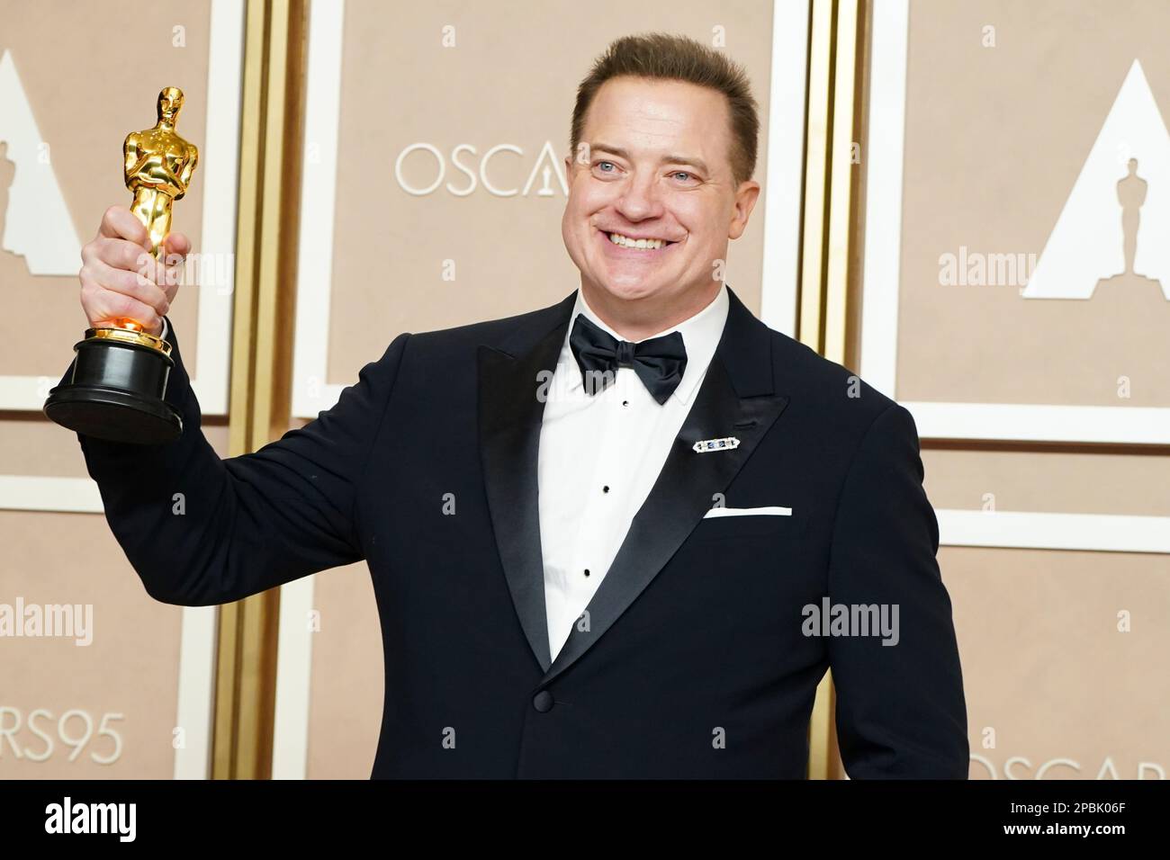 Brendan Fraser poses with the award for best performance by an actor in ...