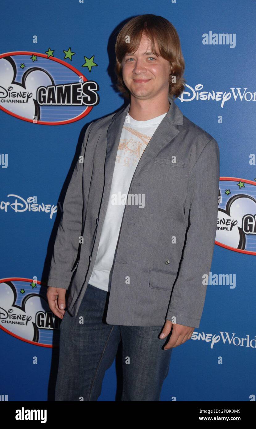Jason Earles, star of "Hannah Montana," poses on the green carpet ...