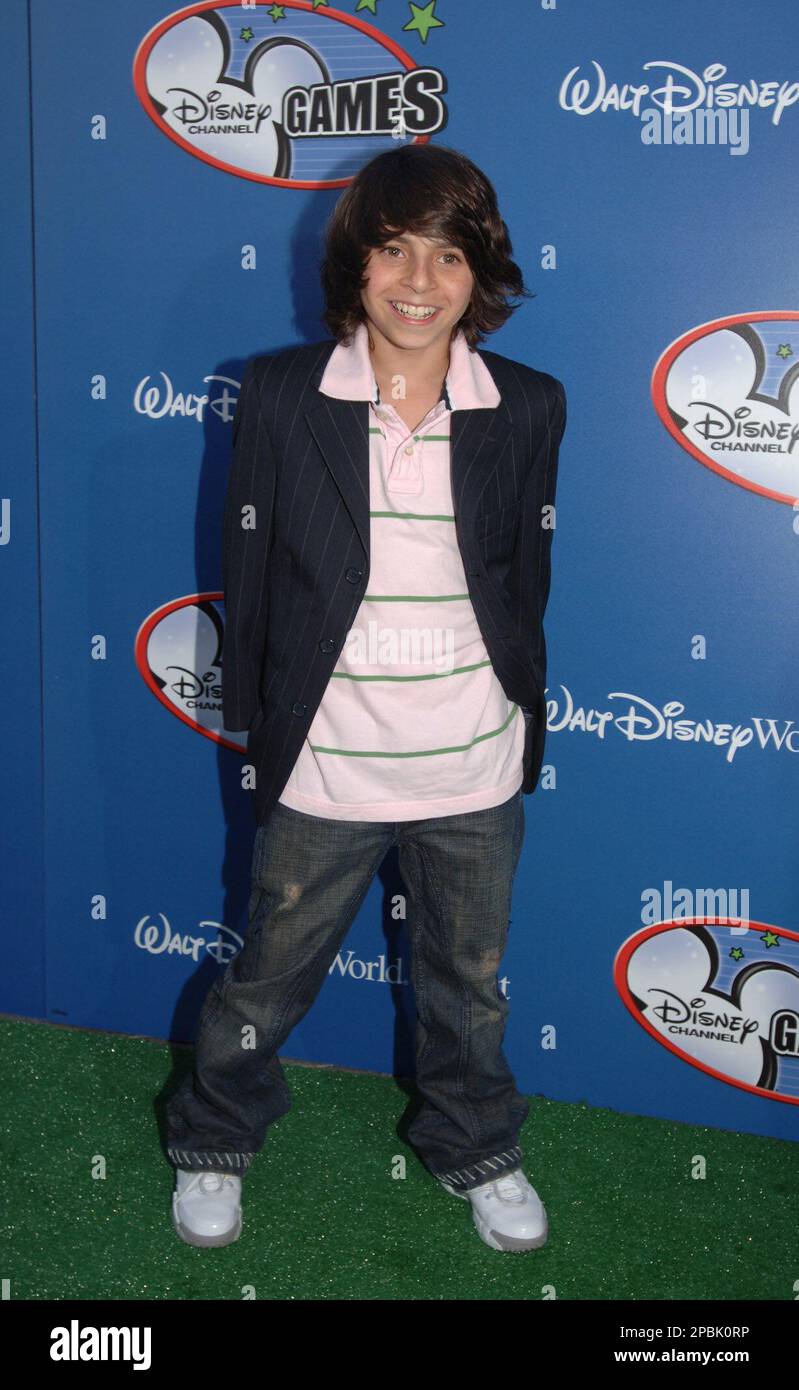 Moises Arias, star of Hanna Montana, poses on the green carpet before ...