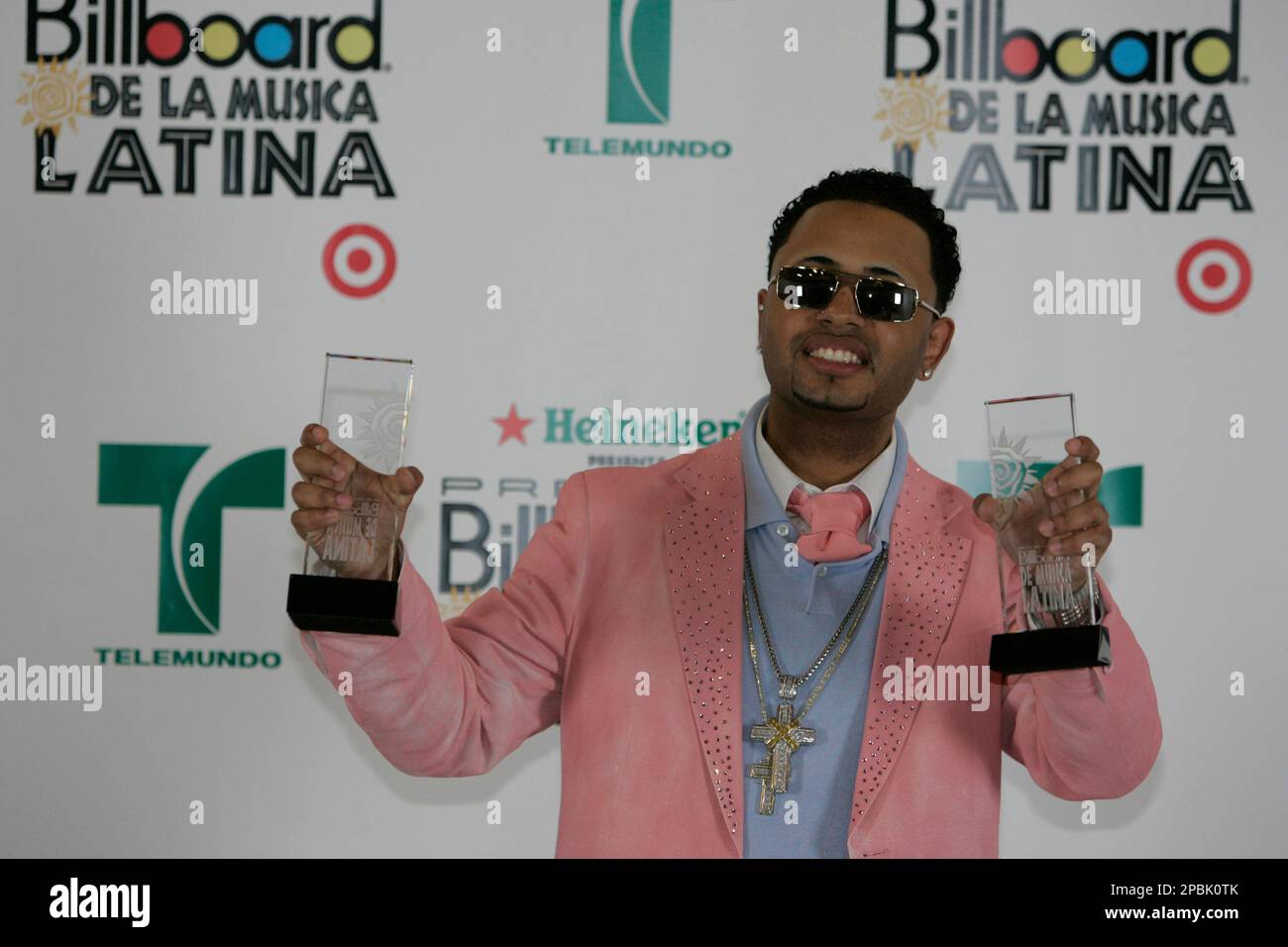 Toby Love poses backstage with his awards for Tropical Airplay Song of ...